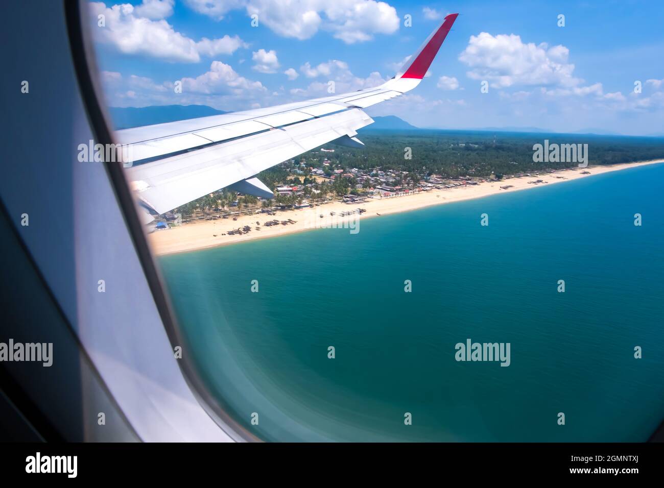 Aerial view of a tropical beach on sunny summer, view from an airplane ...