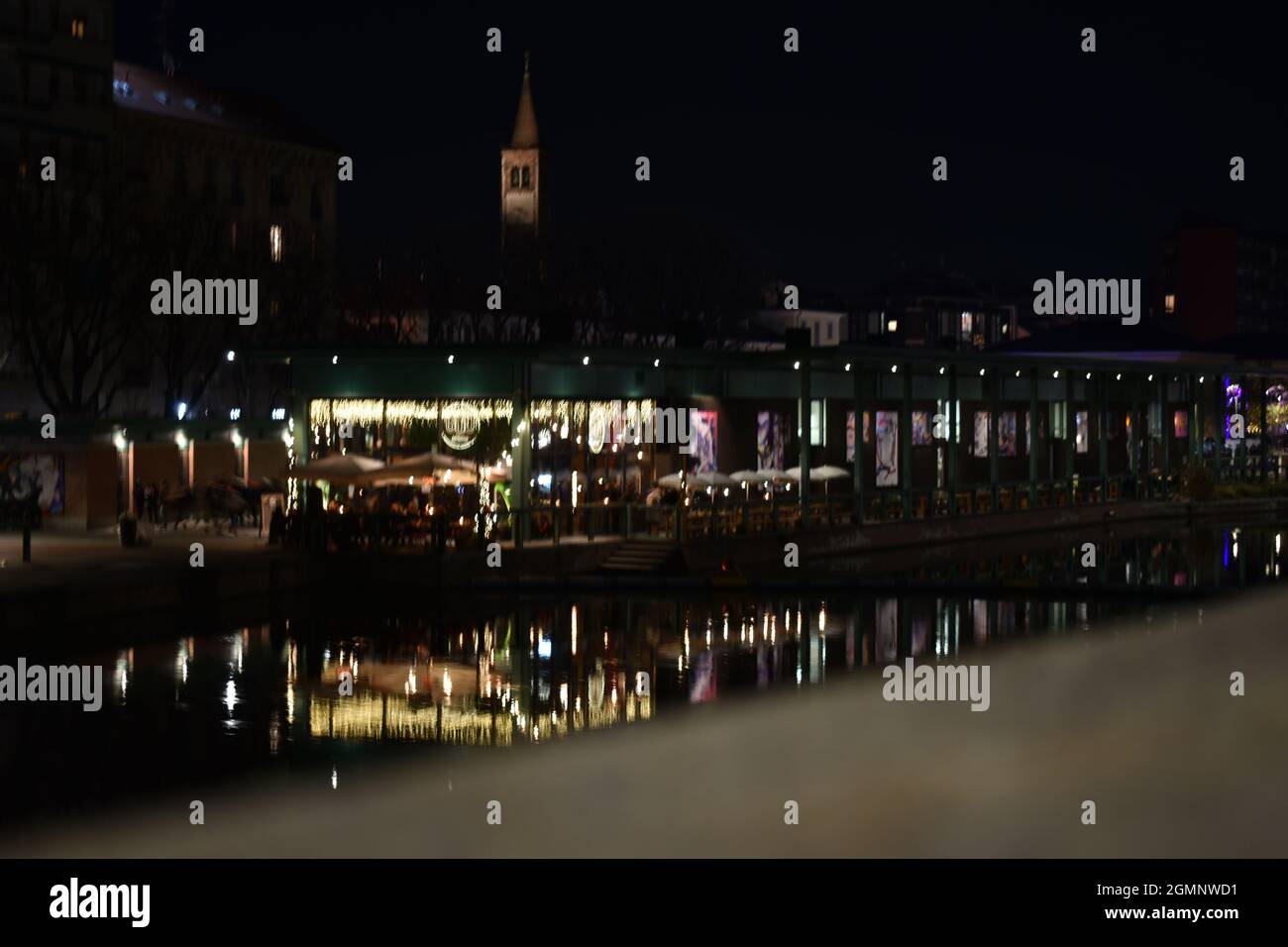 Busy night life in Navigli overseeing a canal Stock Photo - Alamy