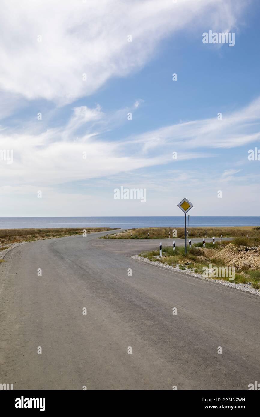Road sign of the main road by the sea. Road along the sea Stock Photo ...