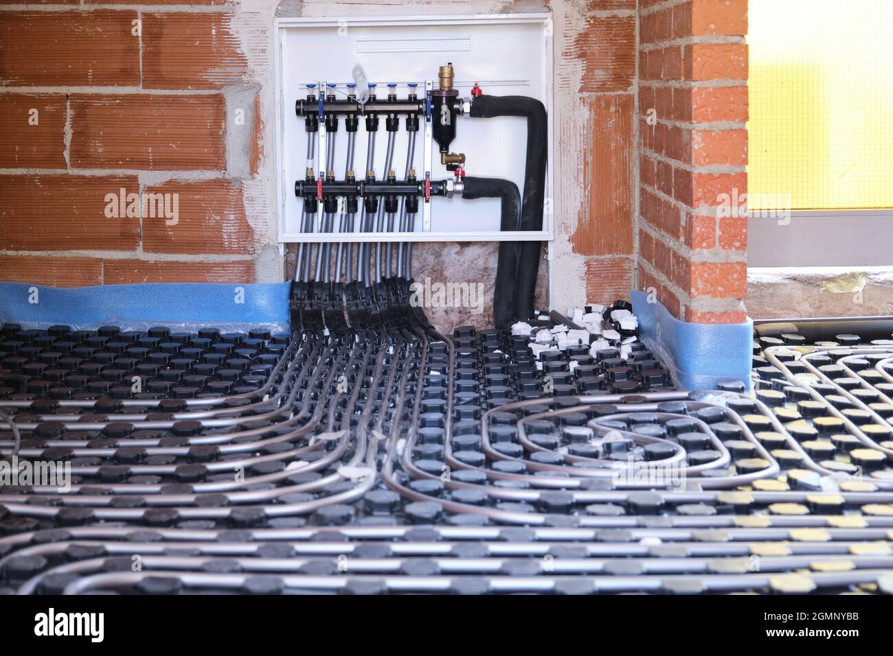 Radiant underfloor heating hydronic manifold with flexible tubing Stock ...