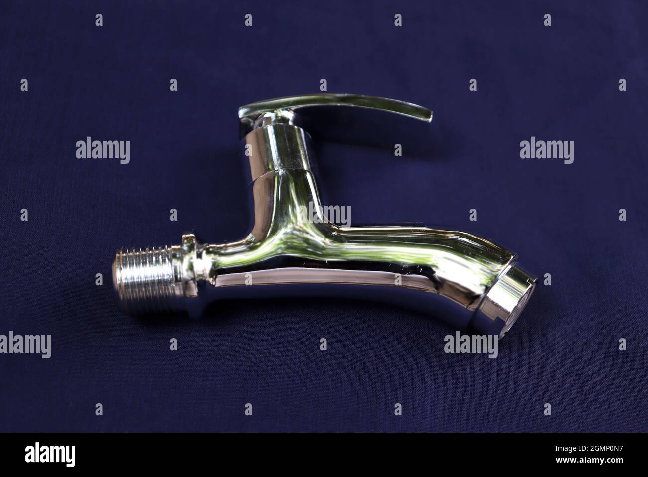 Silvers tap with blue background Stock Photo - Alamy