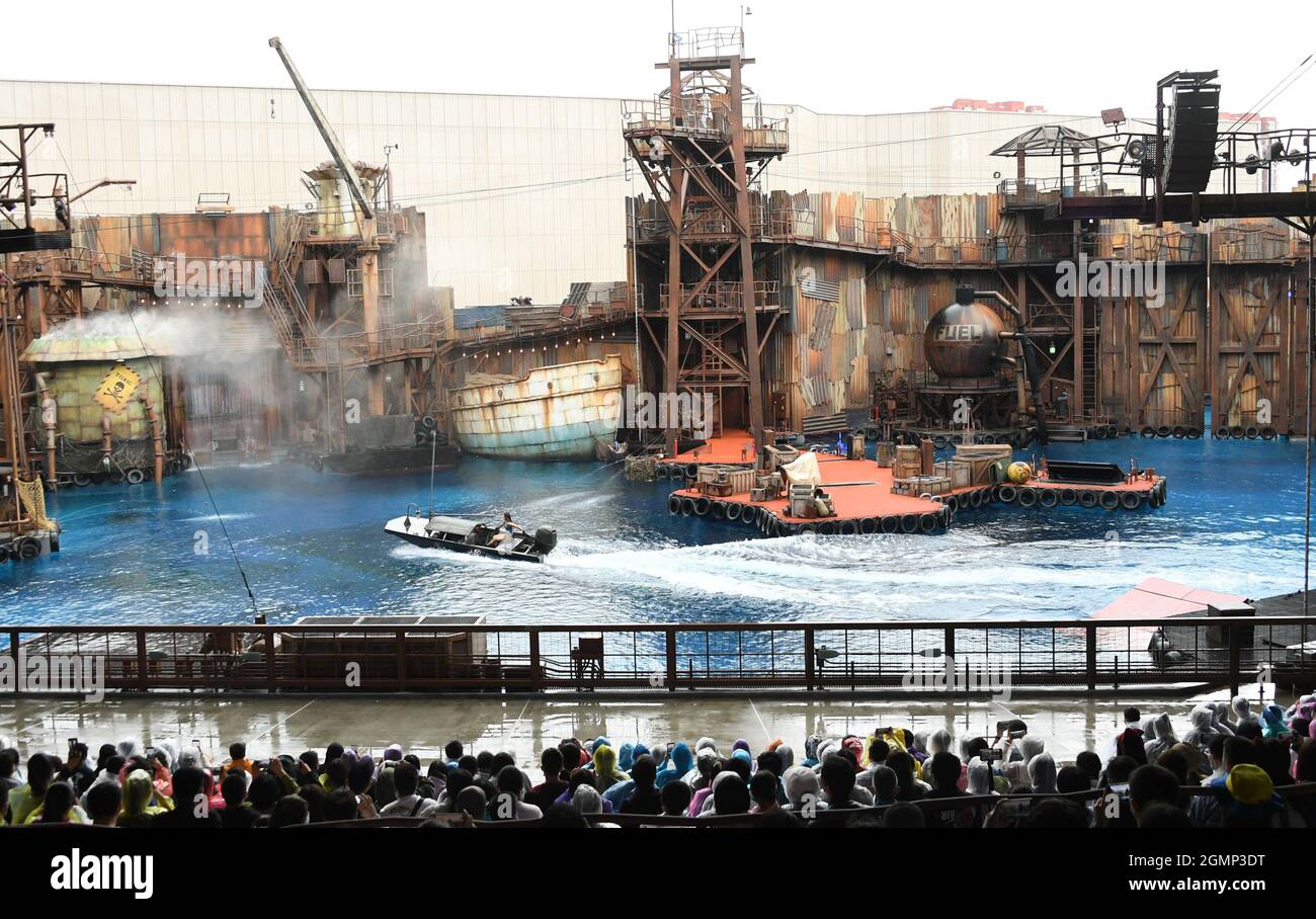 Beijing, China. 20th Sep, 2021. Tourists watch a stunt performance at ...