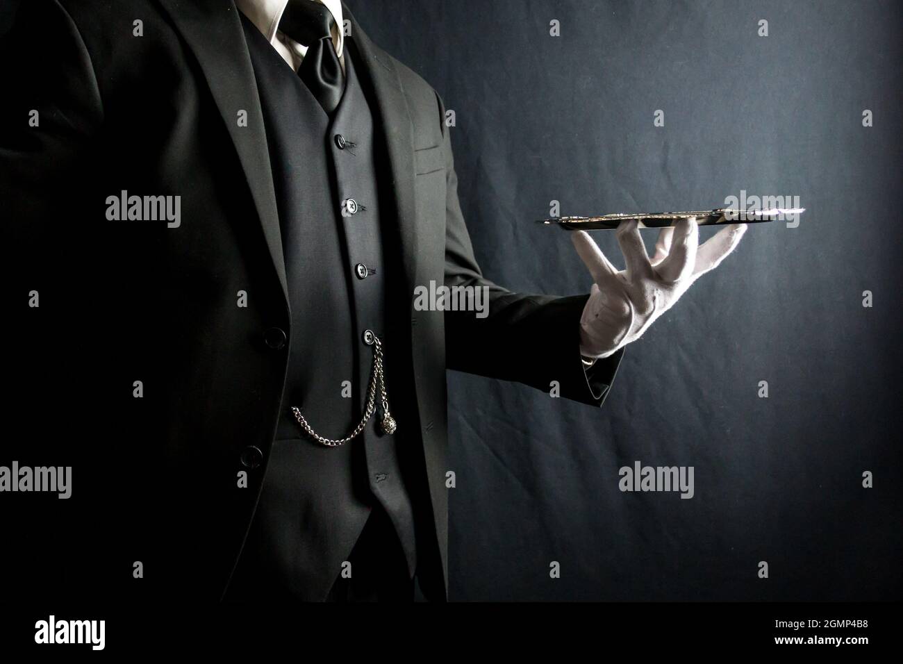 Male waiter in suit hi-res stock photography and images - Alamy