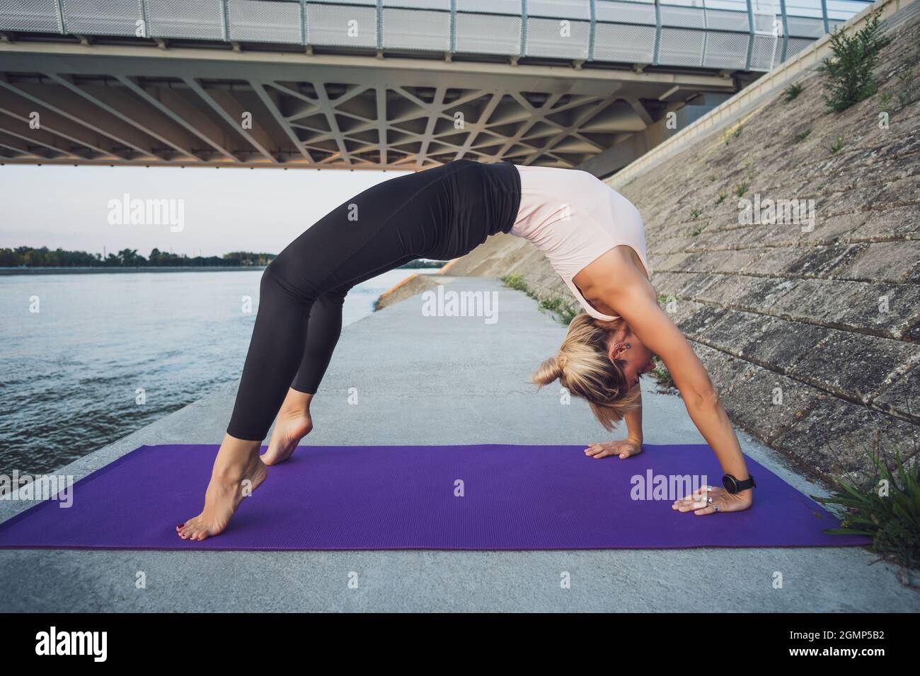 Young Woman Is Exercising Outdoor She Is Practicing Yoga Urdhva