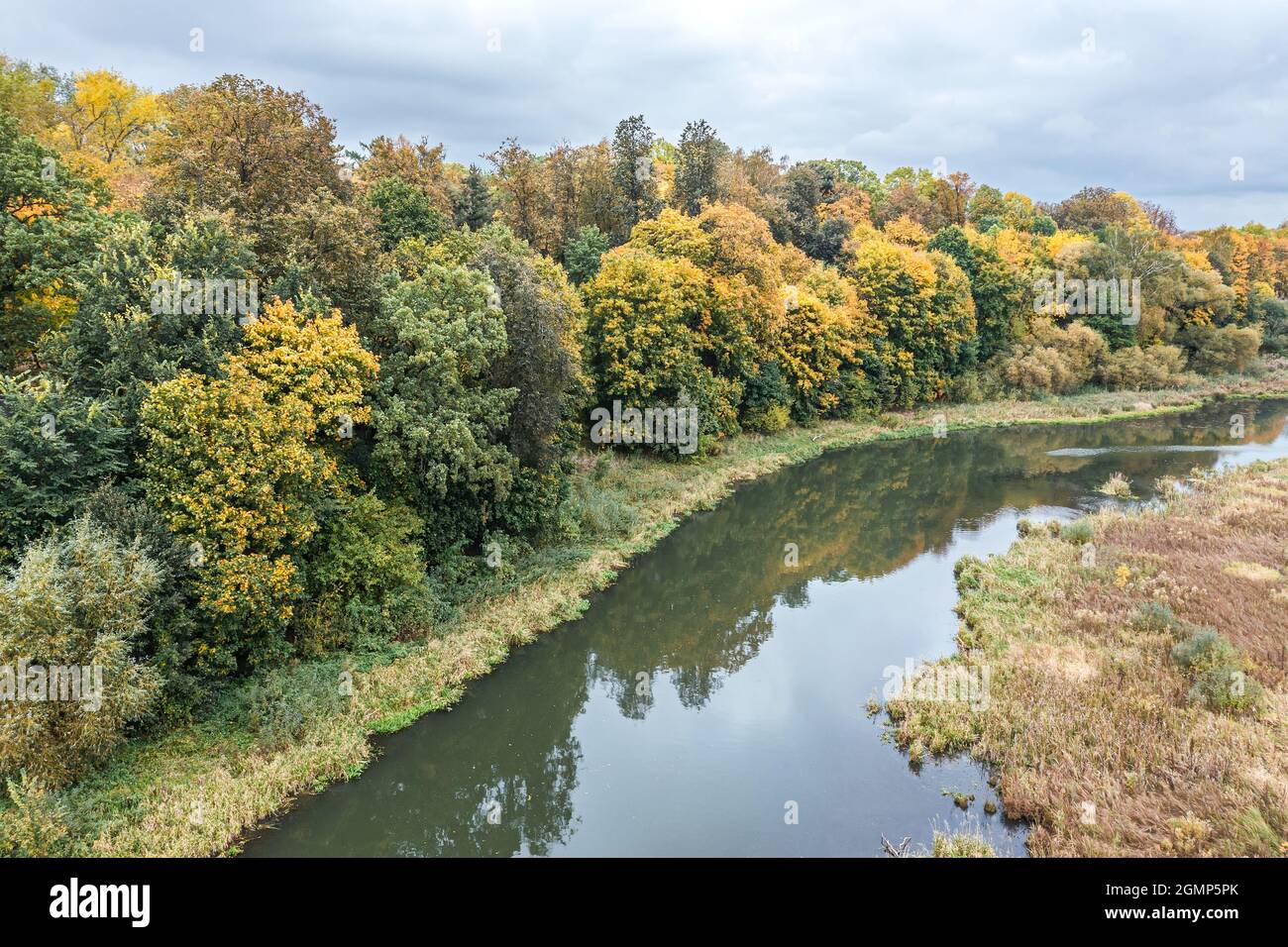 aerial top down view of colorful autumn forest and small river Stock ...