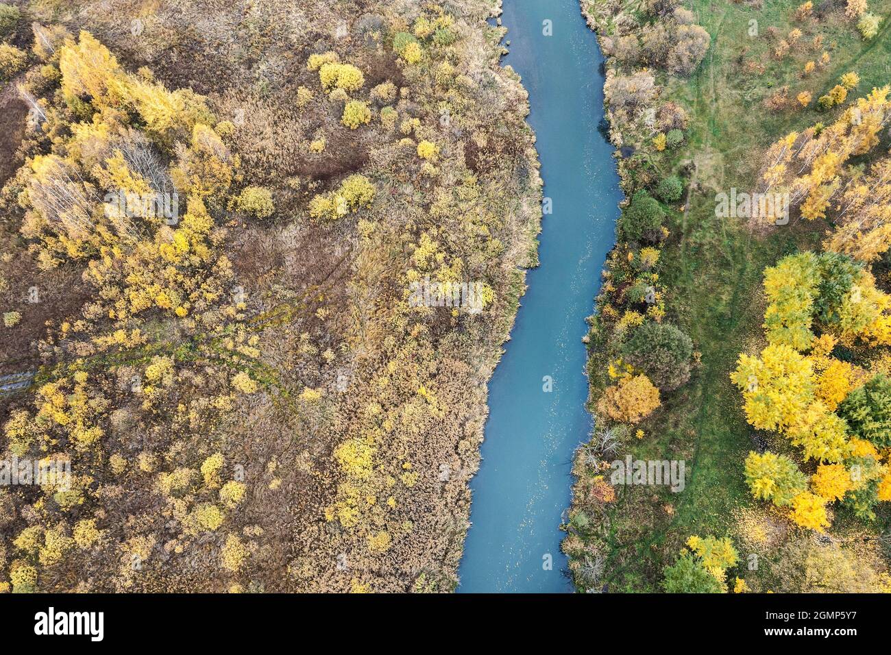 aerial top down view of small river in swampy area. autumn nature ...