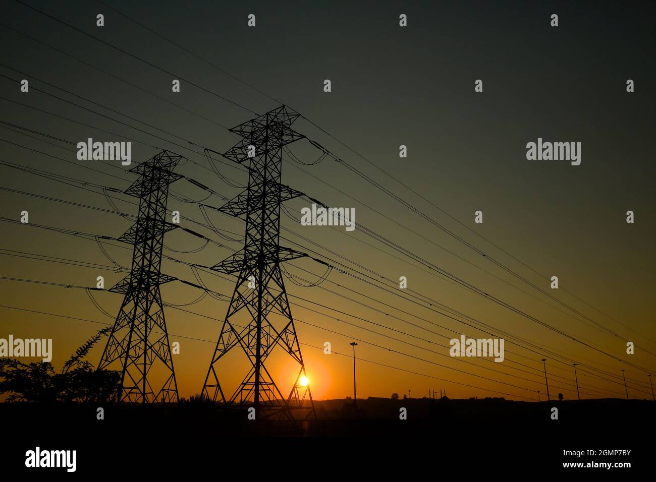 electricity poles under the sunset Stock Photo - Alamy