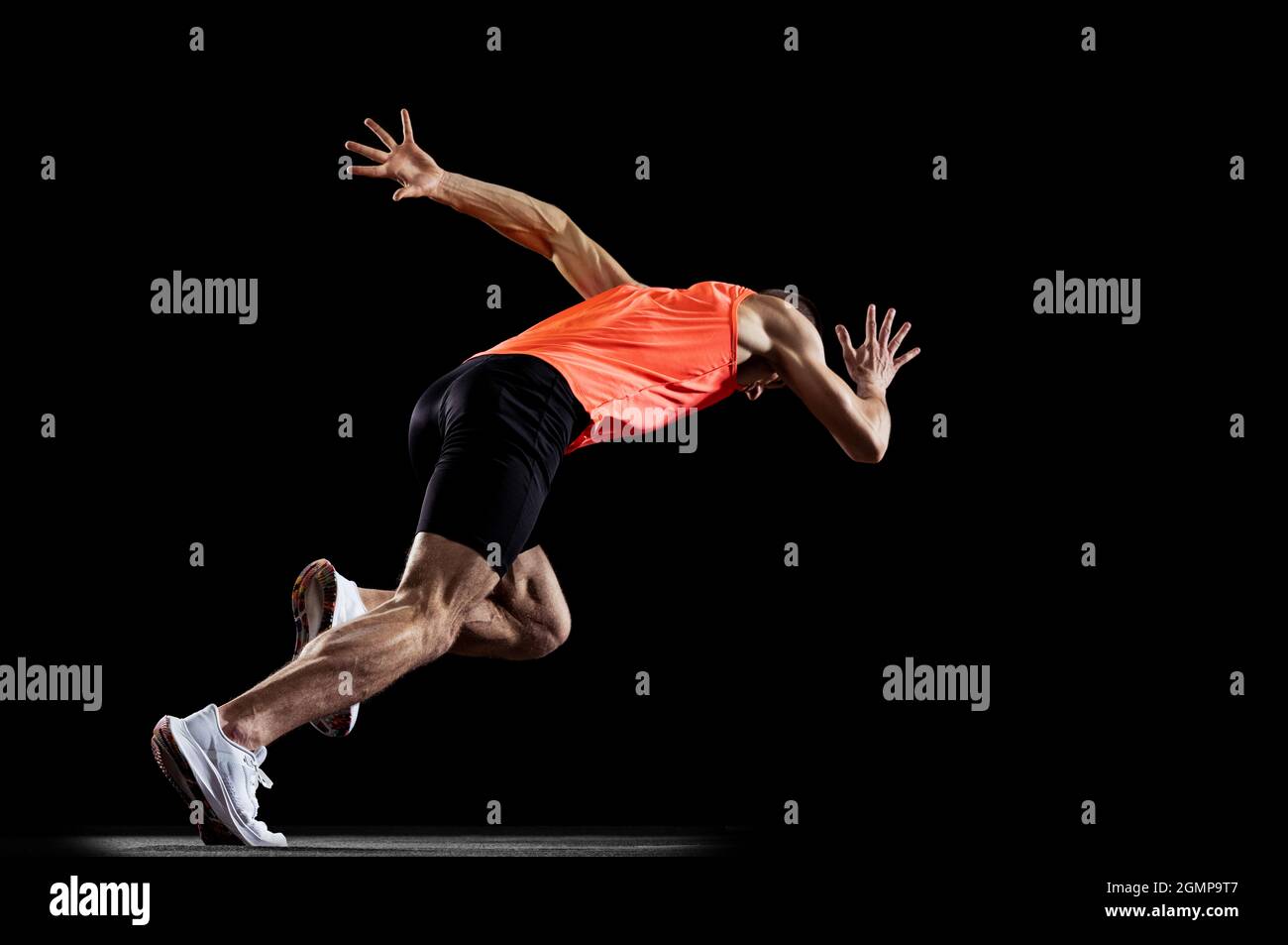 Full-length side view portrait of young male professional athlete ...