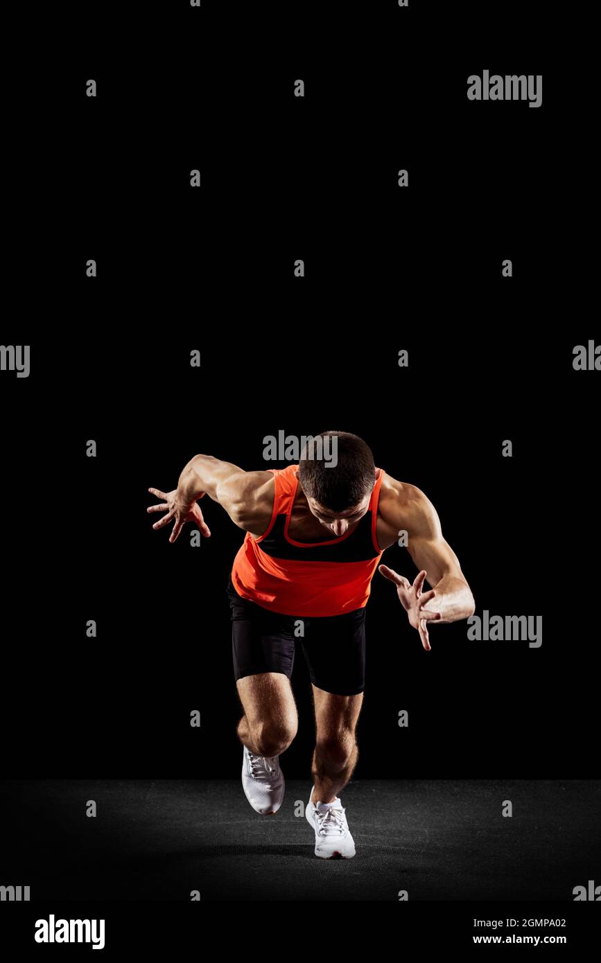 Full-length front view portrait of young male professional athlete ...