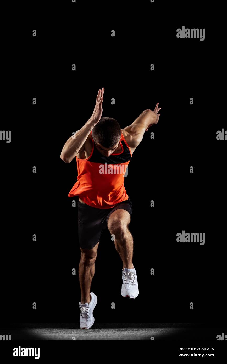 Full-length front view portrait of young male professional athlete ...