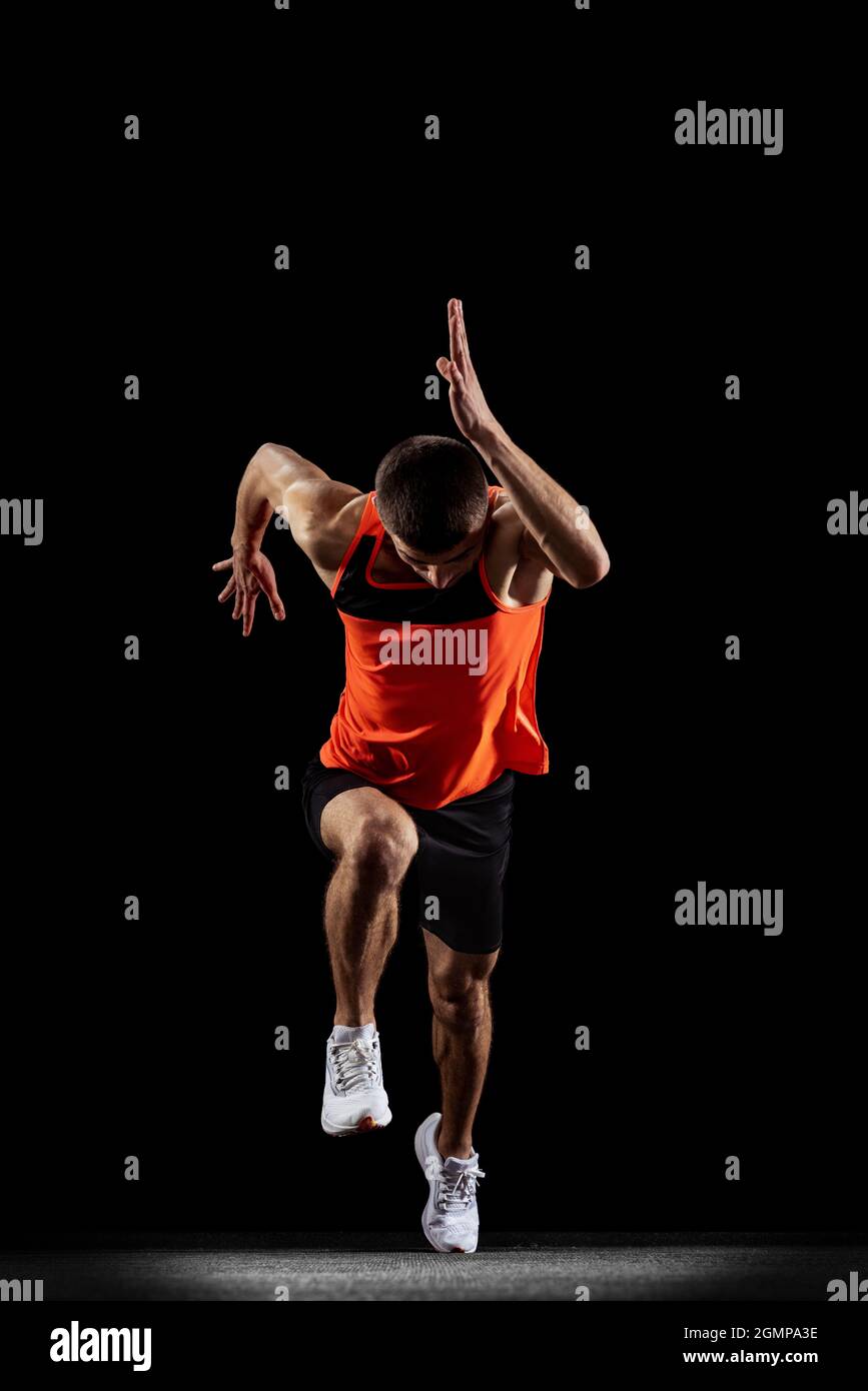 Full-length front view portrait of young male professional athlete ...