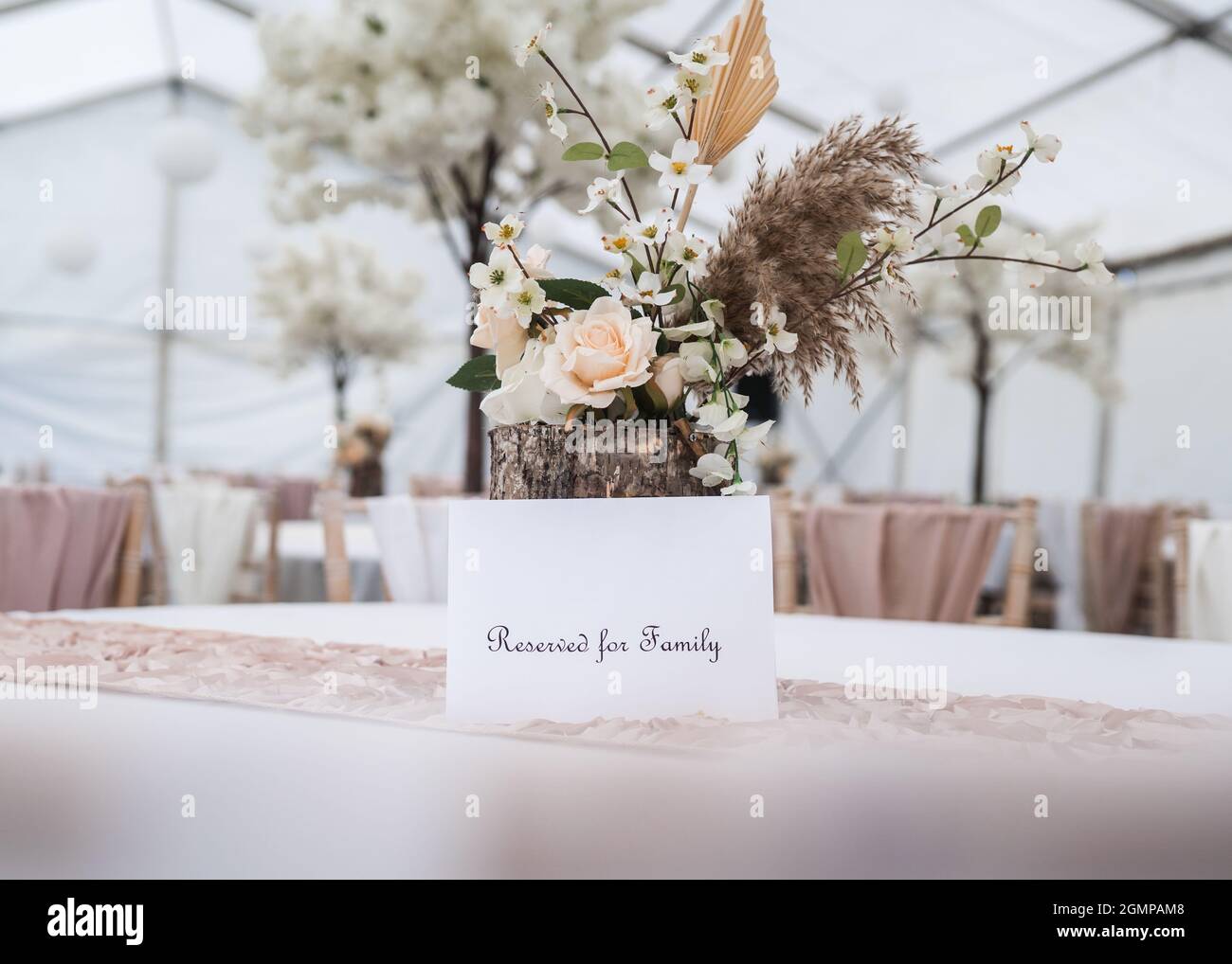 Reserved table sign reserved held for family only with flowers and ...