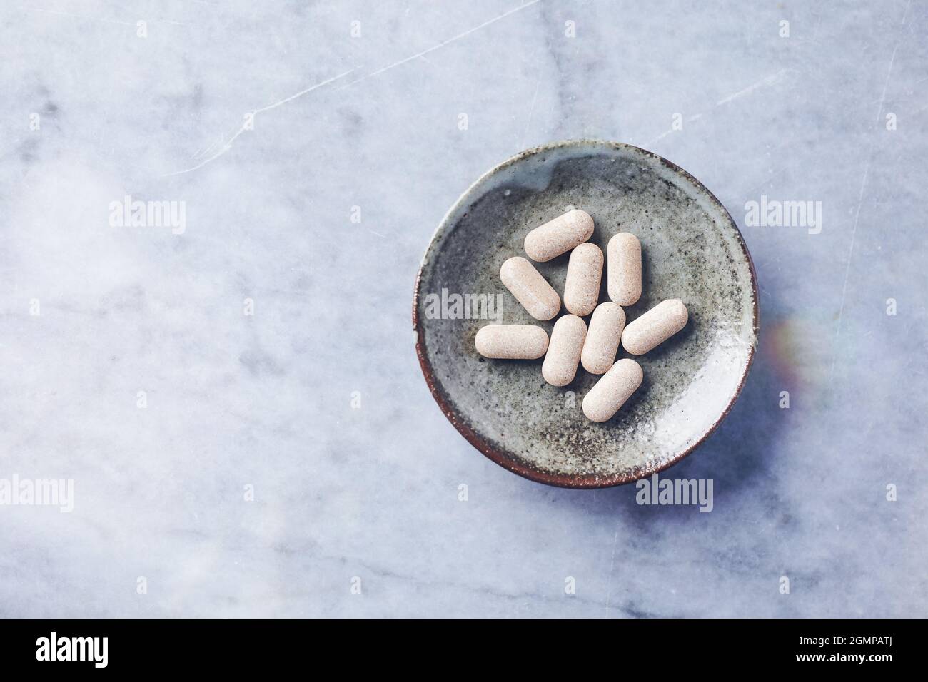 Rhodiola rosea. Golden root, rose root. Herbal pills with healthy ...