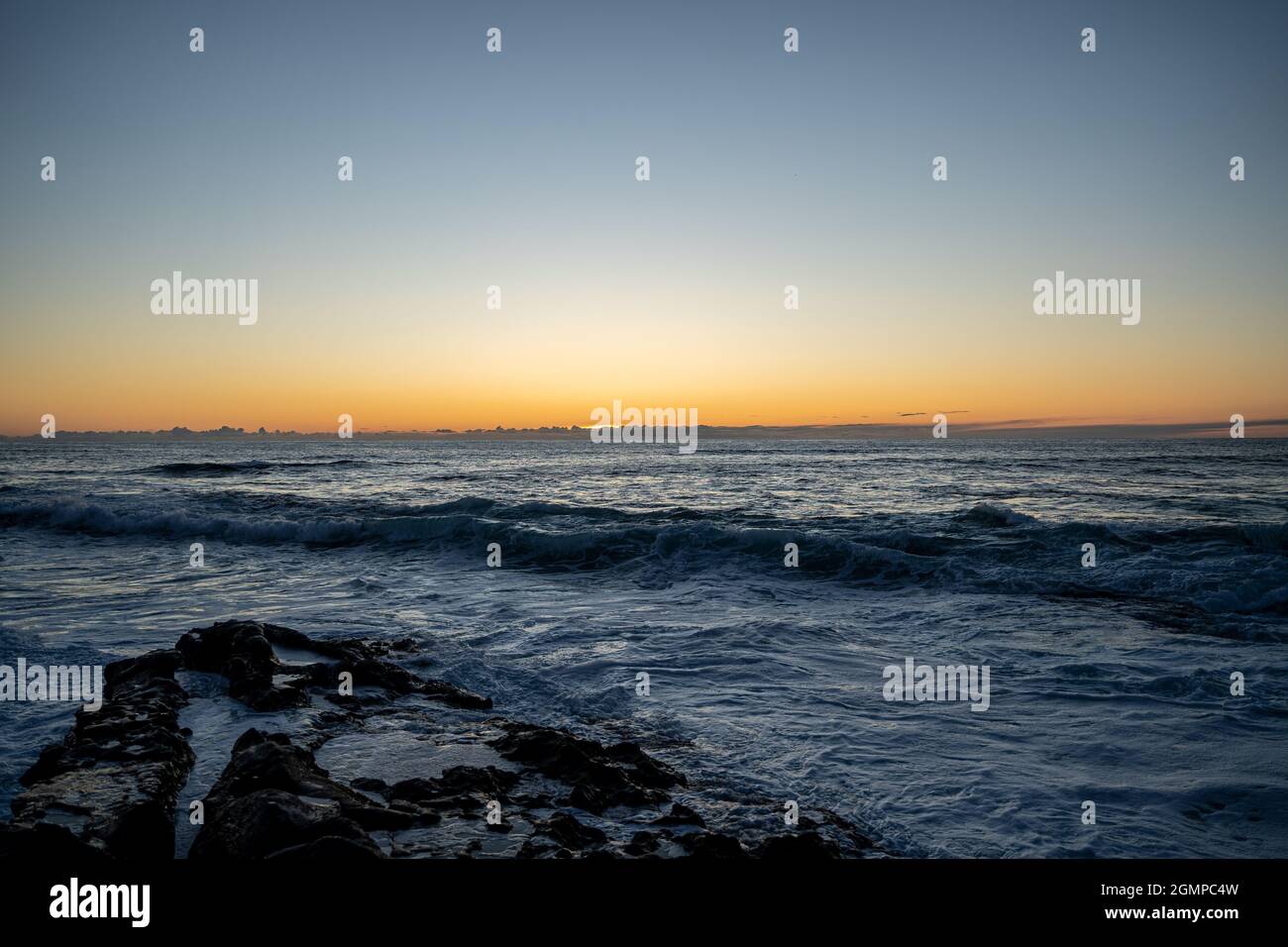 Beautiful horizon of the sea on the sunset Stock Photo - Alamy