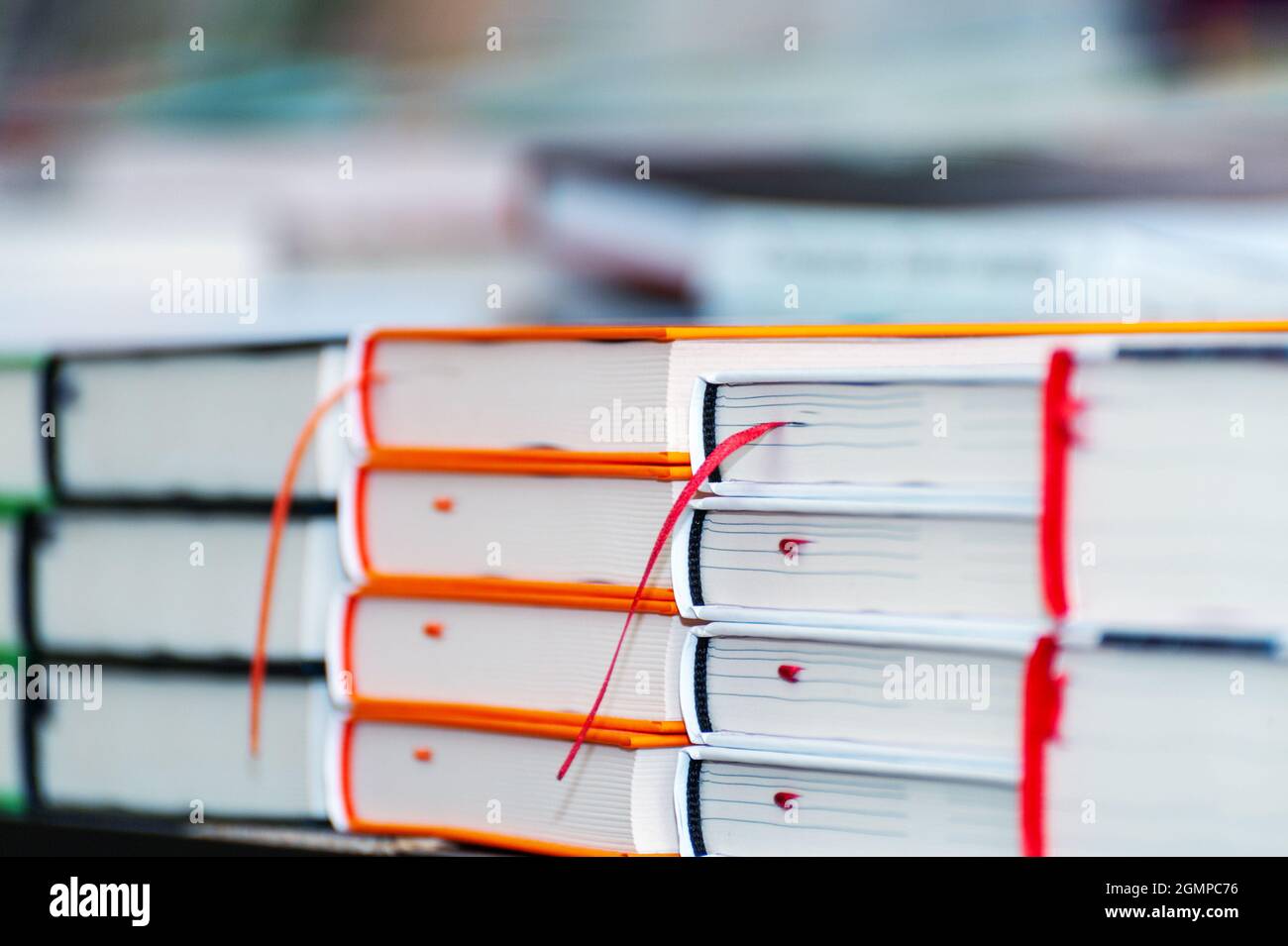 Stack of new books on the table. Books on the forum of manufacturers of ...