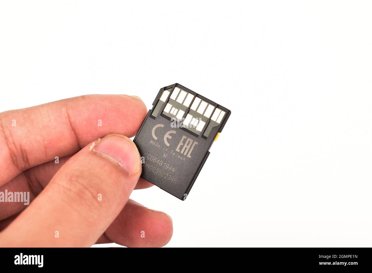 Hand holding High Speed Memory Card Isolated on White Background With ...