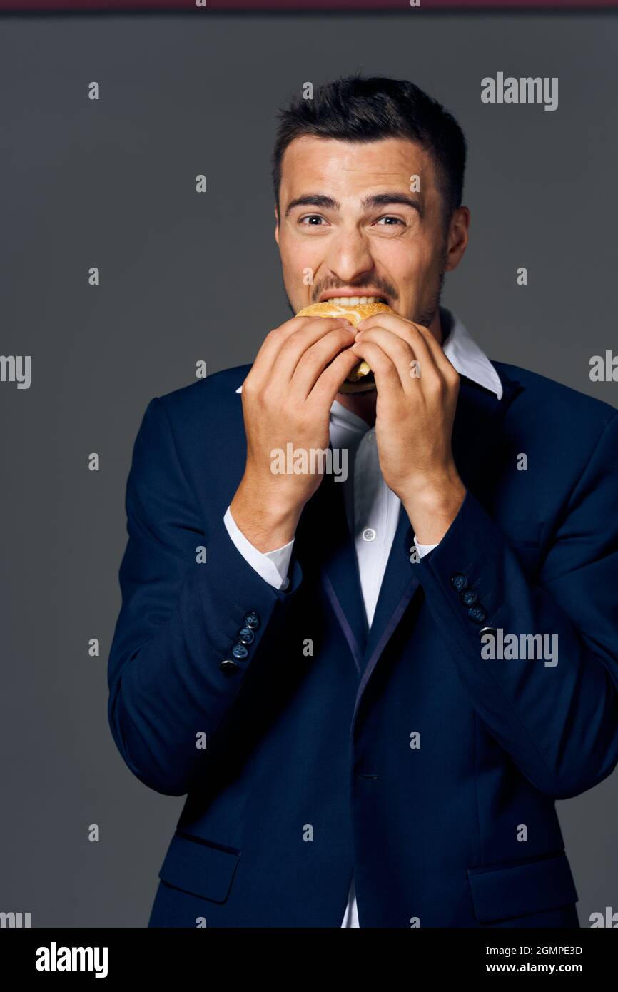 Fat man eating suit hi-res stock photography and images - Alamy