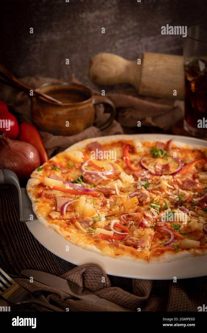 Italian tasty pizza in a kitchen Stock Photo - Alamy