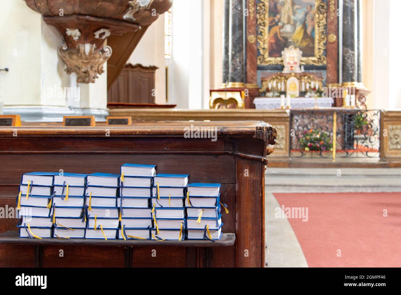 A stacks of books for prayer and religious sing on the shelf in the ...