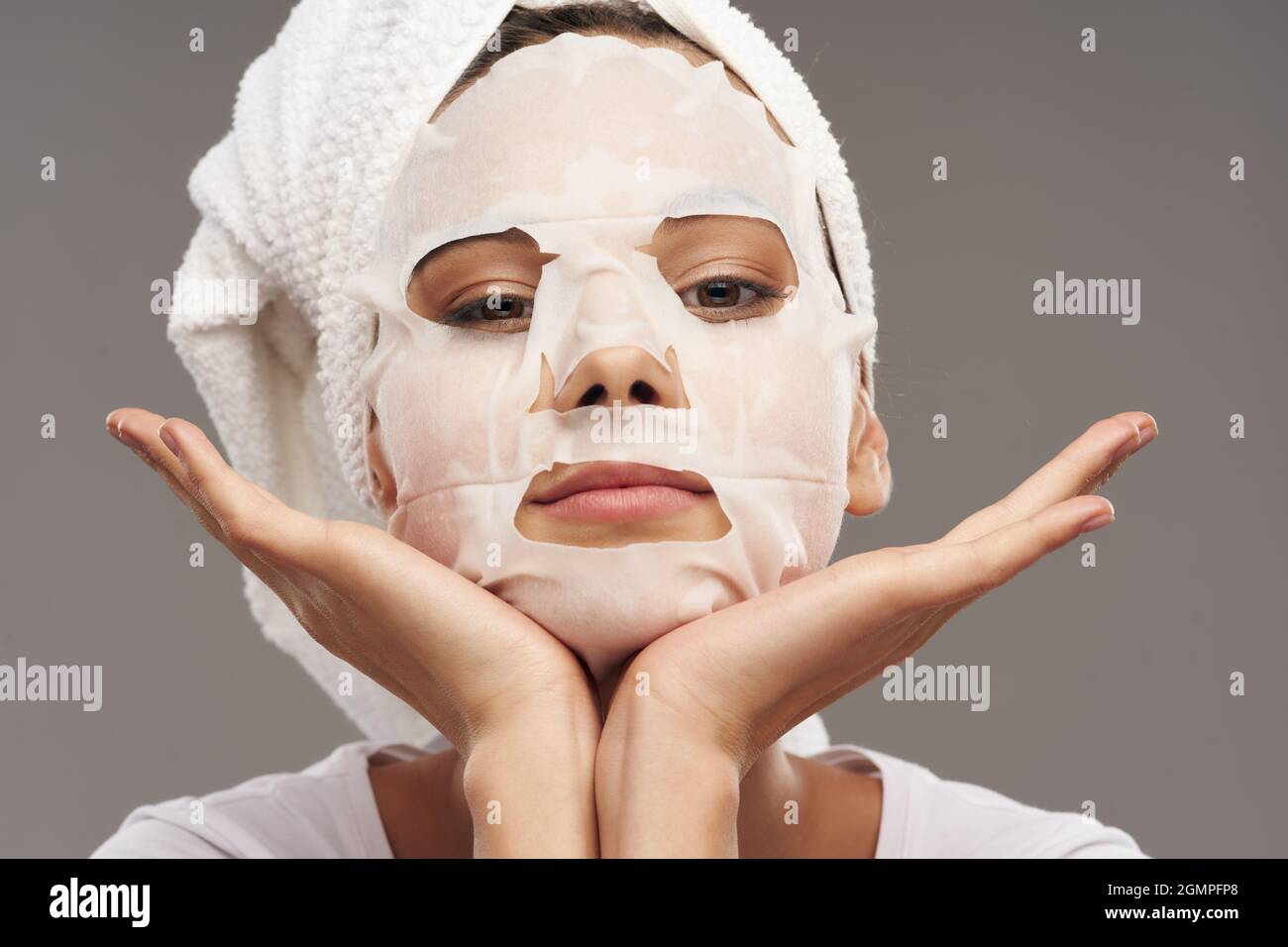woman in a mask with a towel on her head skin care cosmetology Stock ...