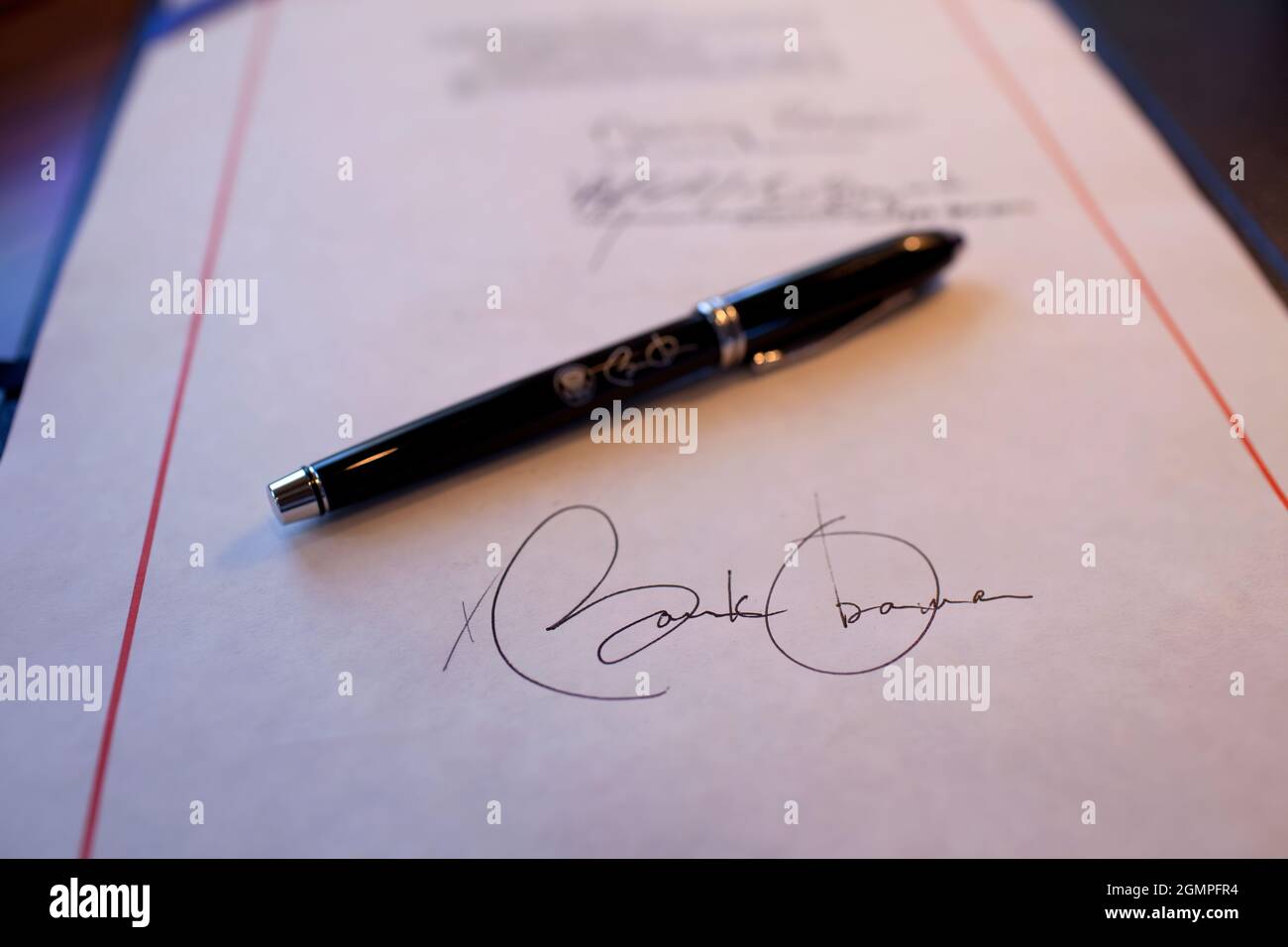 Close-up detail of President Obama's signature on a bill, and a pen ...