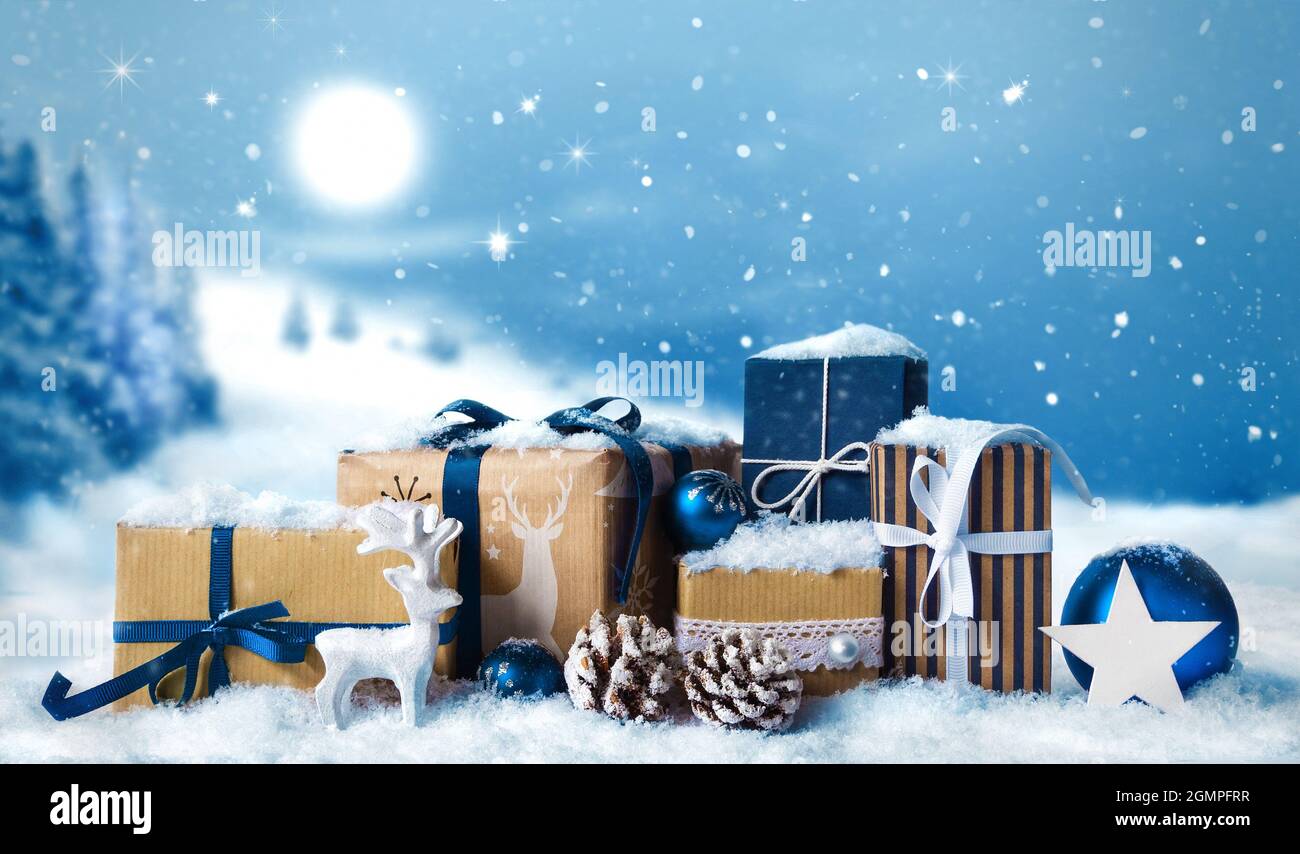 Christmas gifts on the snow background hi-res stock photography and ...