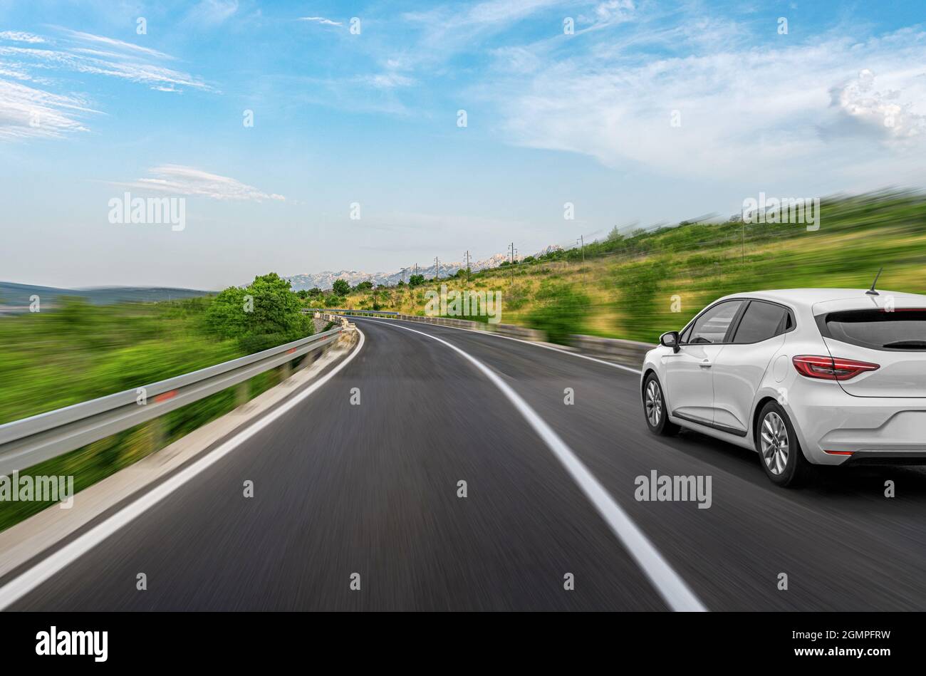 Car is driving along the road. White car on a suburban highway Stock ...