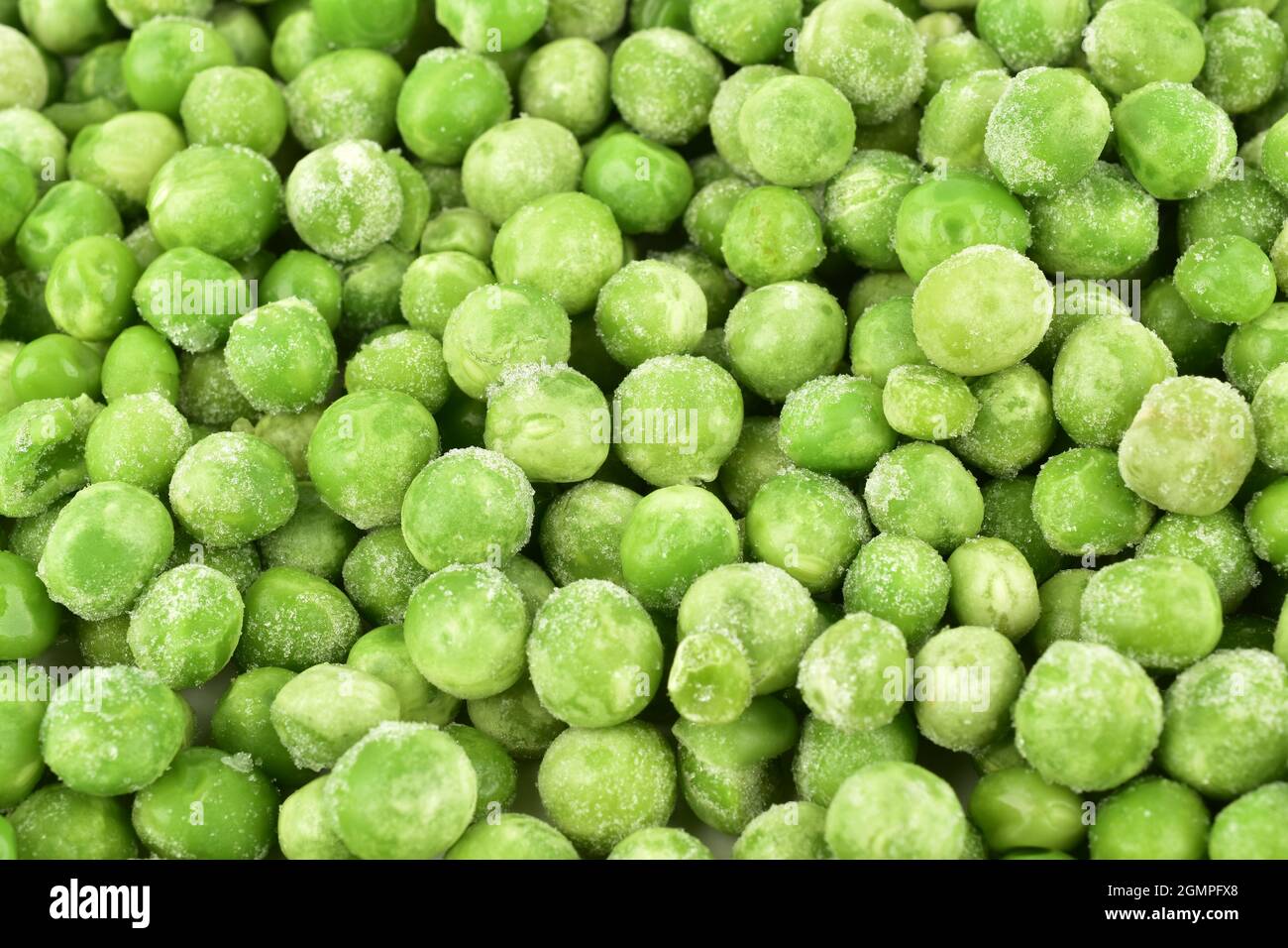 Cold Fresh peas. Green background Stock Photo - Alamy