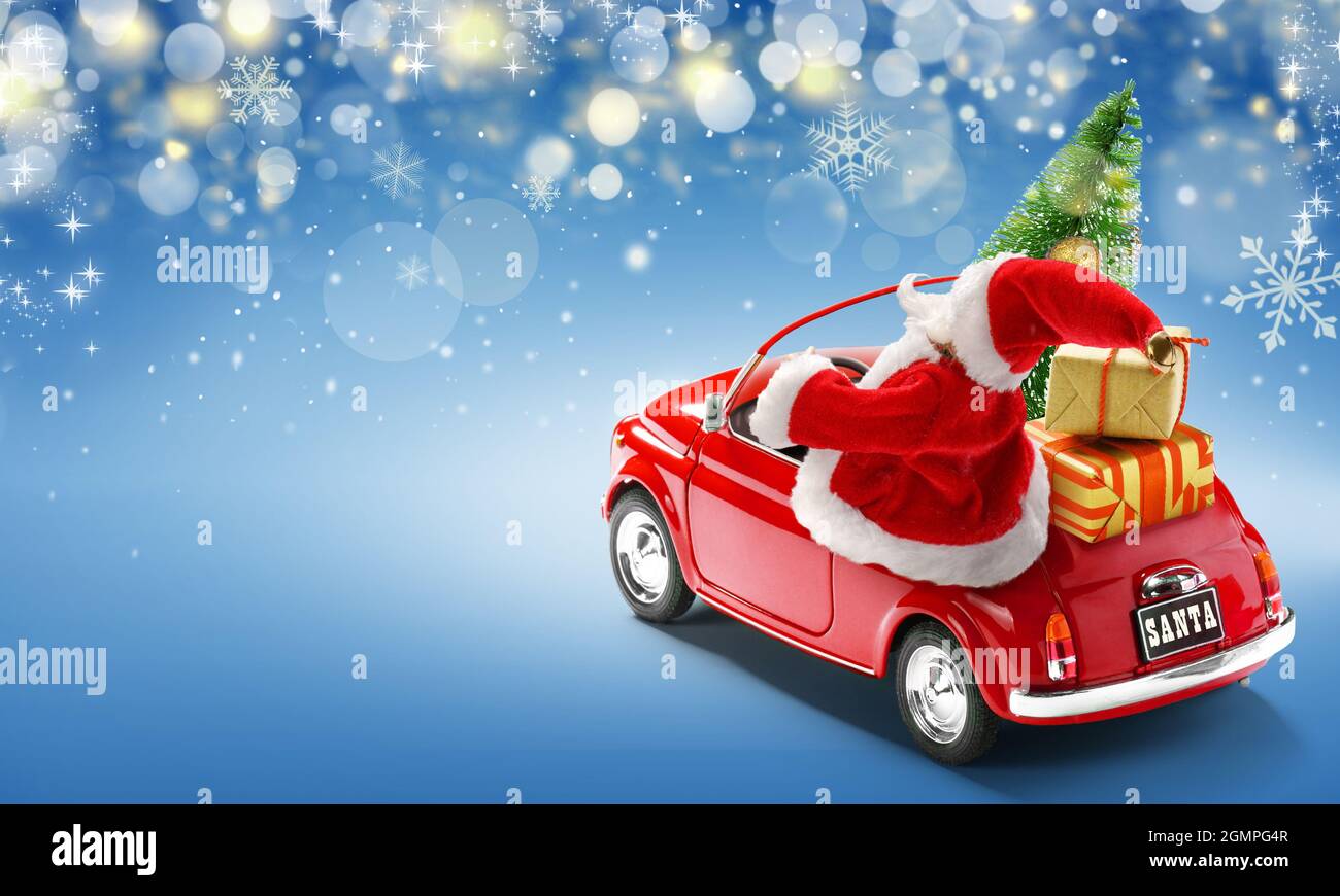Santa Claus driving red car with gift boxes and Christmas tree on blue ...