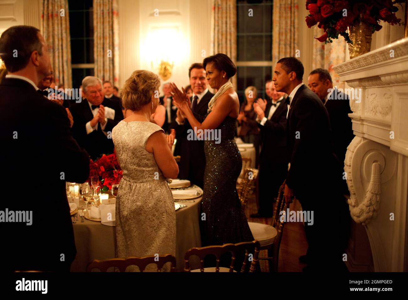 President Barack Obama pulls out the chair for First Lady Michelle ...