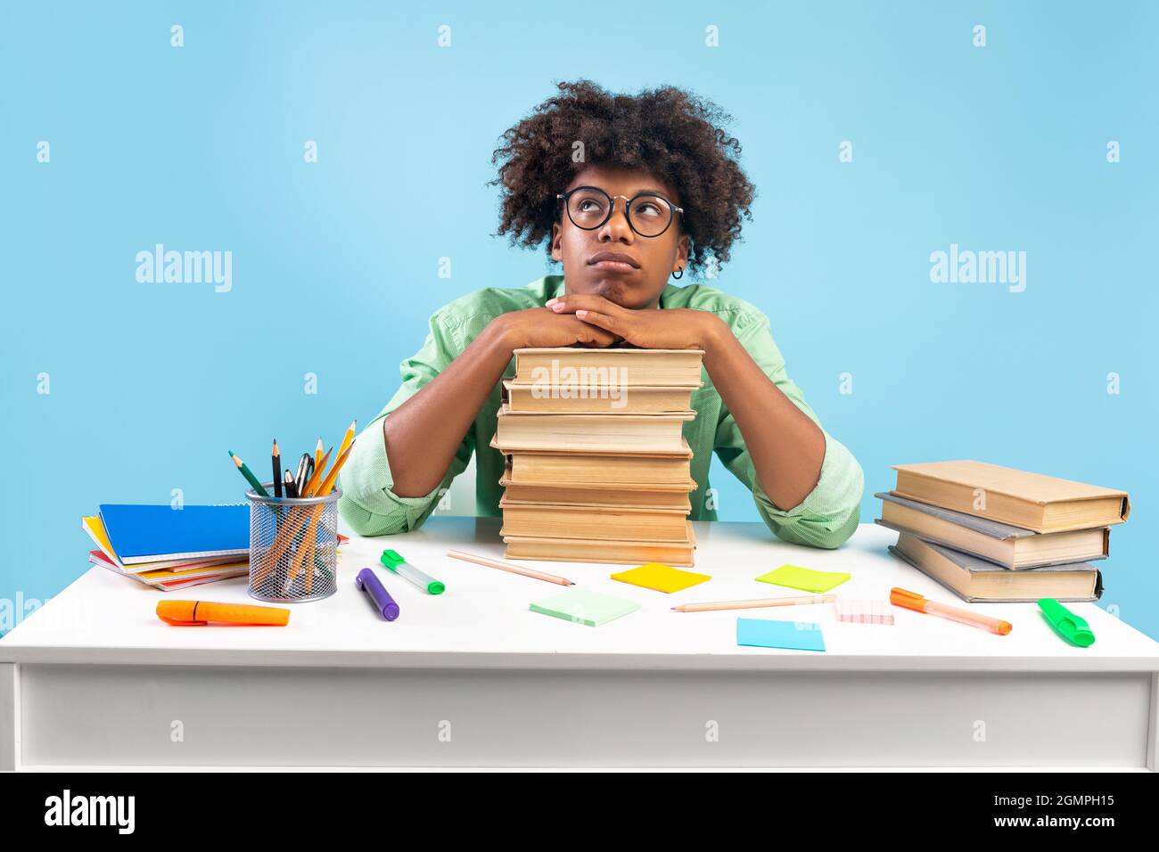 Stressed male teen with books hi-res stock photography and images - Alamy