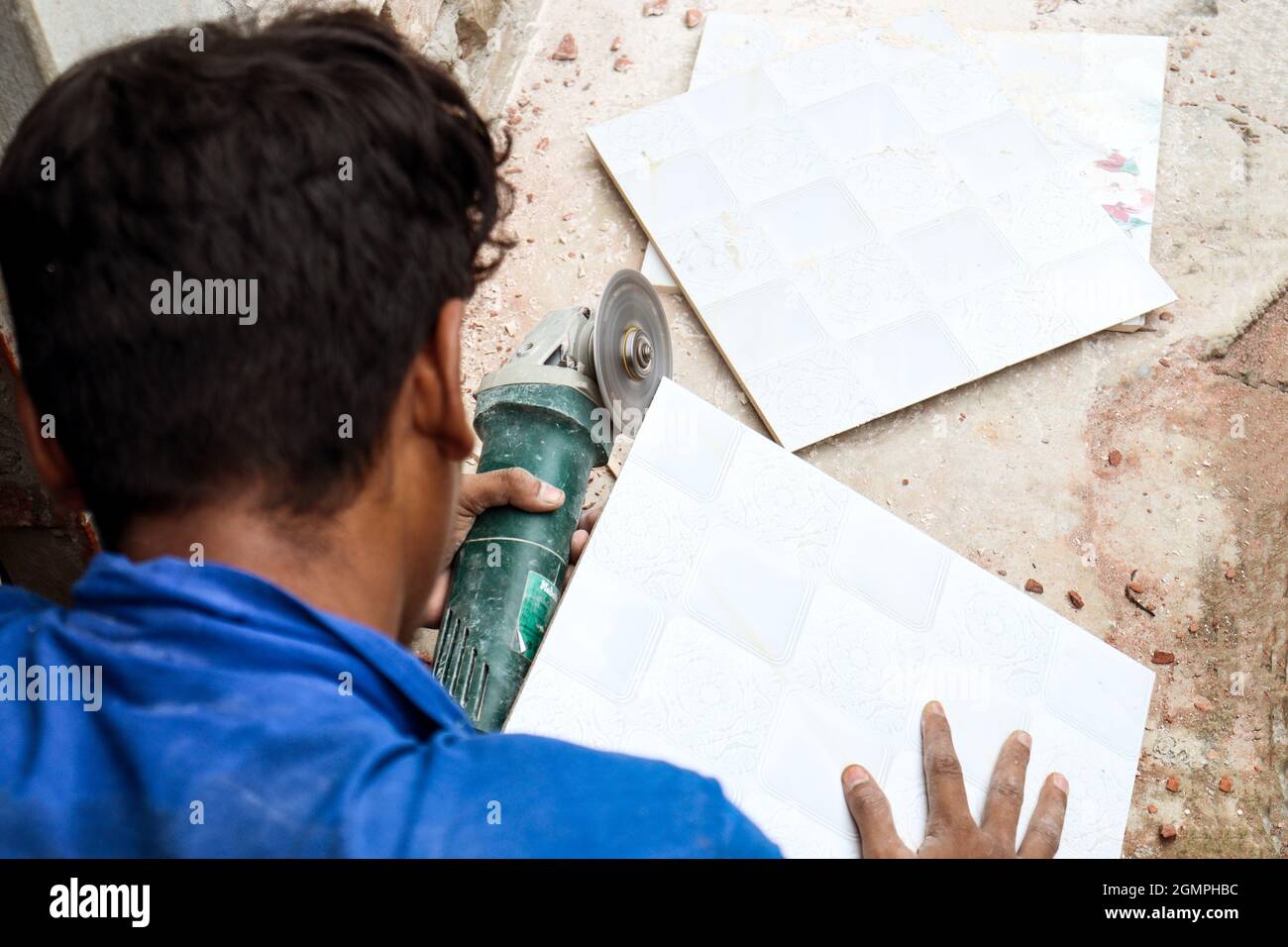 tile cutter machine with blade in house with worker Stock Photo - Alamy