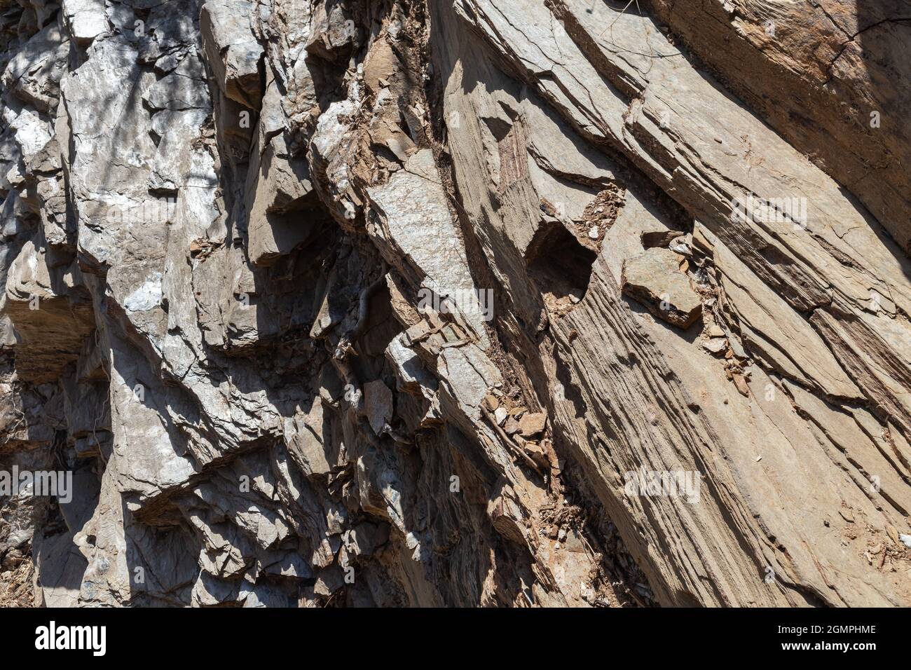 Closeup shot of part of mountain shows the geological formation of its ...