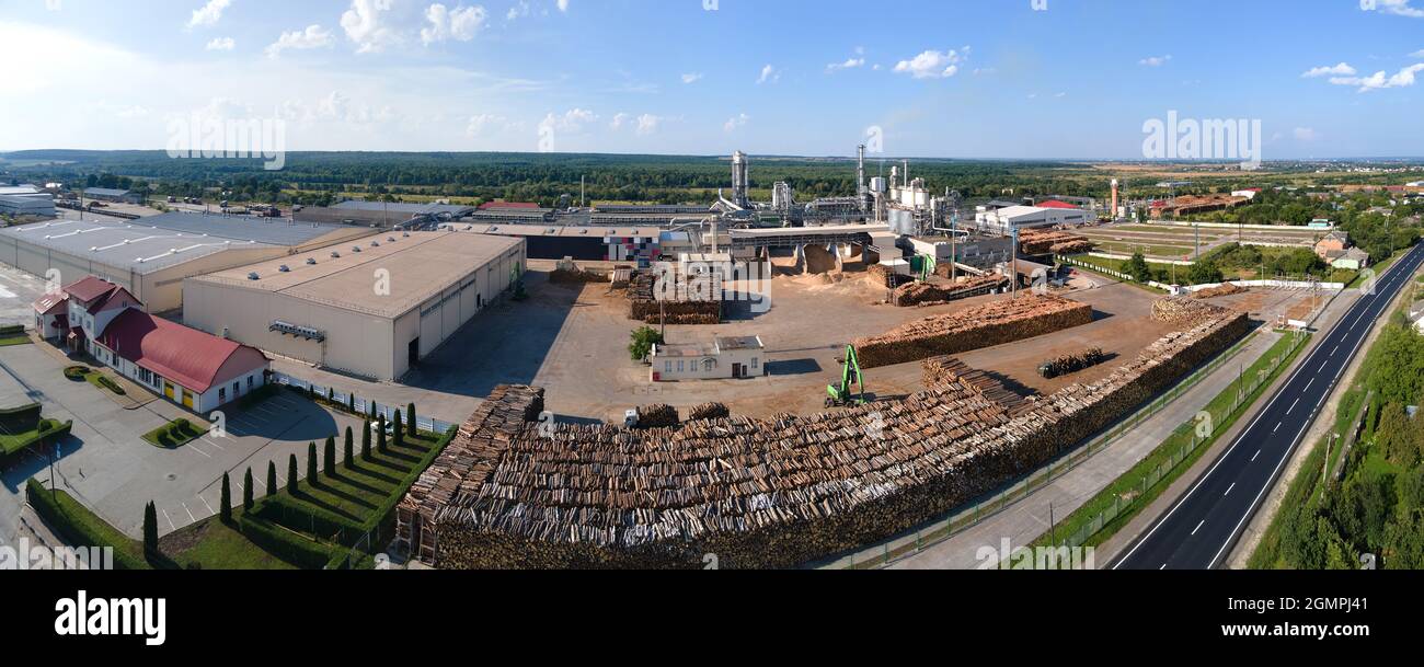 Aerial view of wood processing factory with stacks of lumber at plant ...