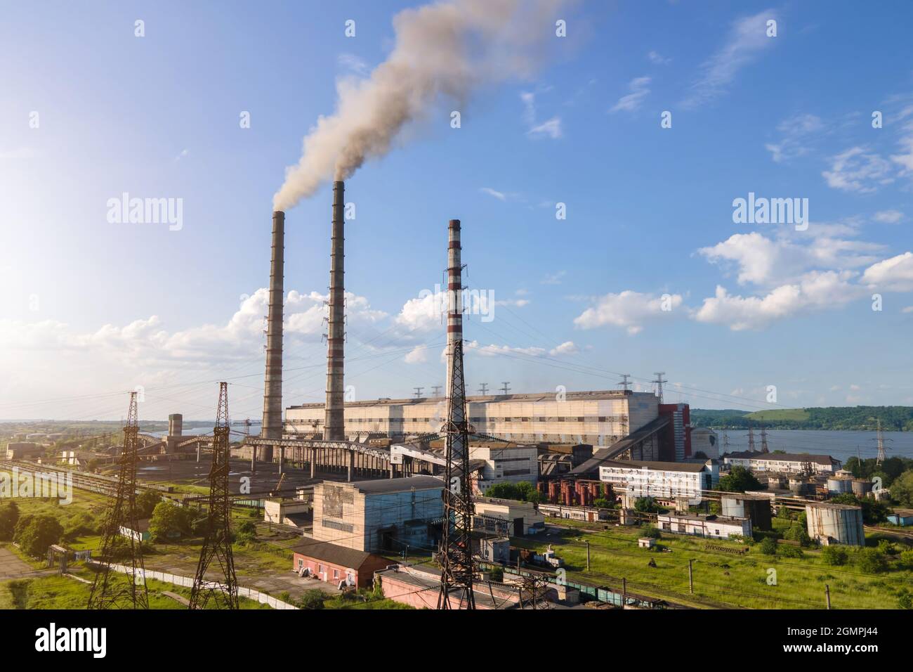 Aerial view of coal power plant high pipes with black smokestack ...