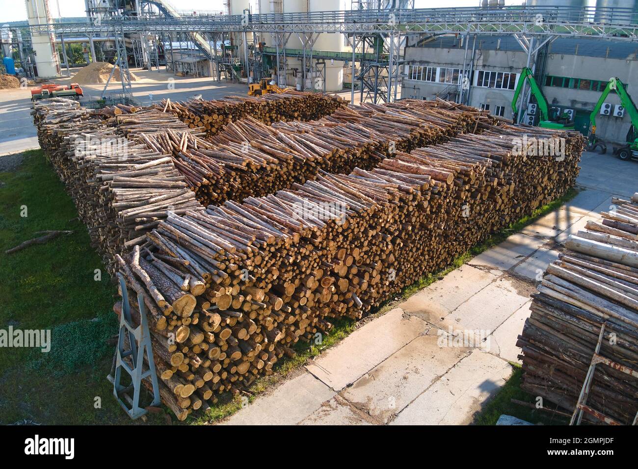Aerial view of wood processing factory with stacks of lumber at plant ...