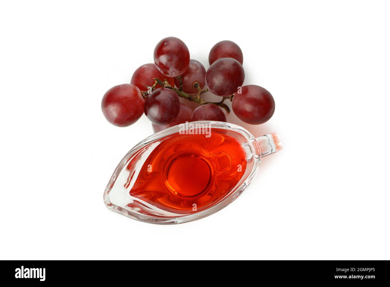Sauce boat with vinegar and grape isolated on white background Stock ...