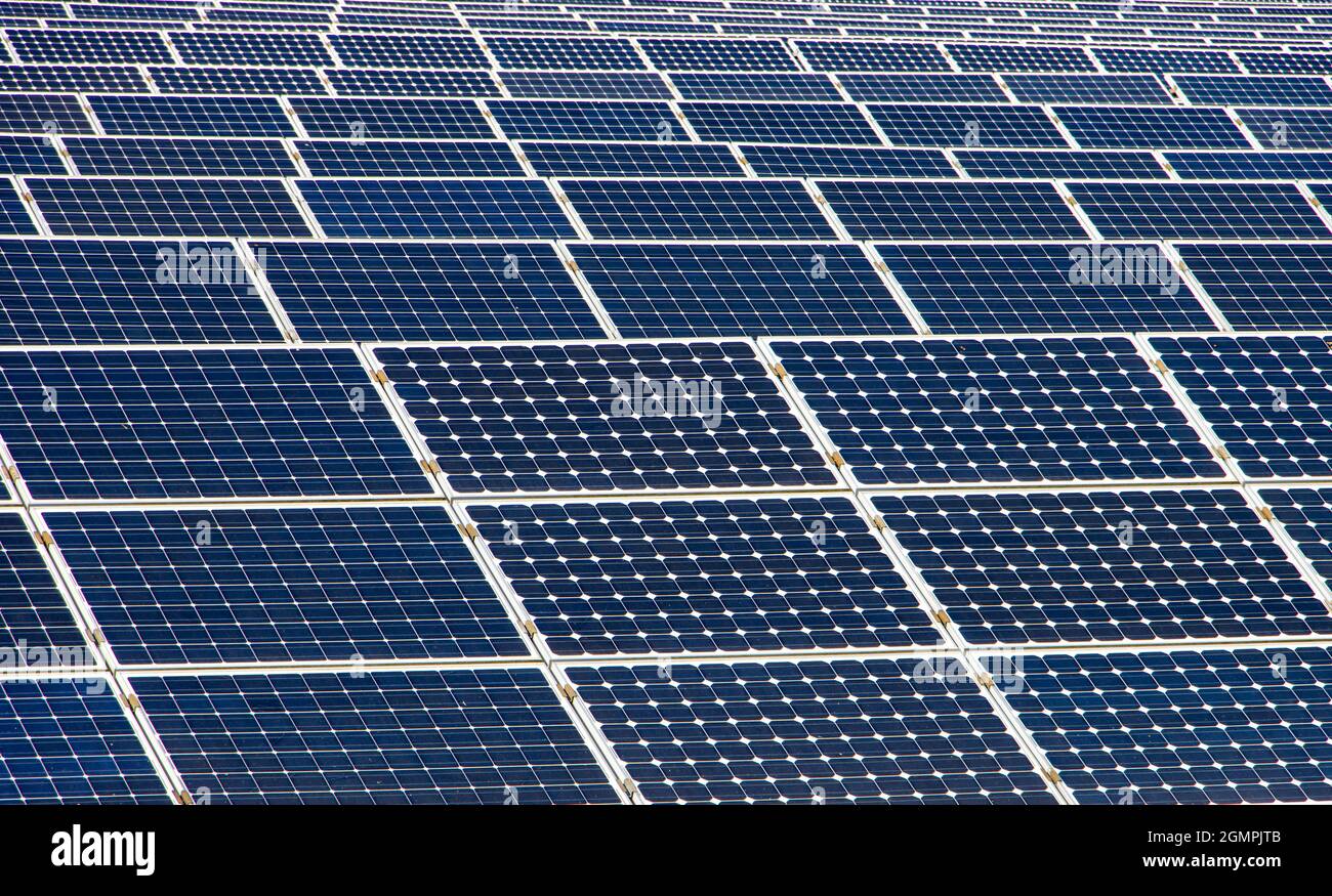 Rows of solar panels in a solar power plant Stock Photo - Alamy