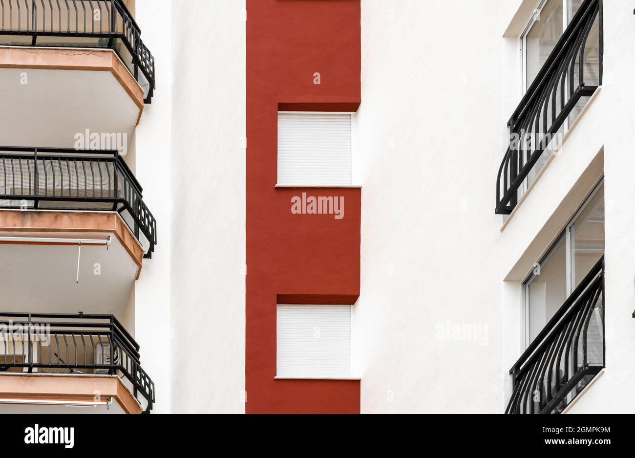 Balconies of a white building facing each other Stock Photo - Alamy