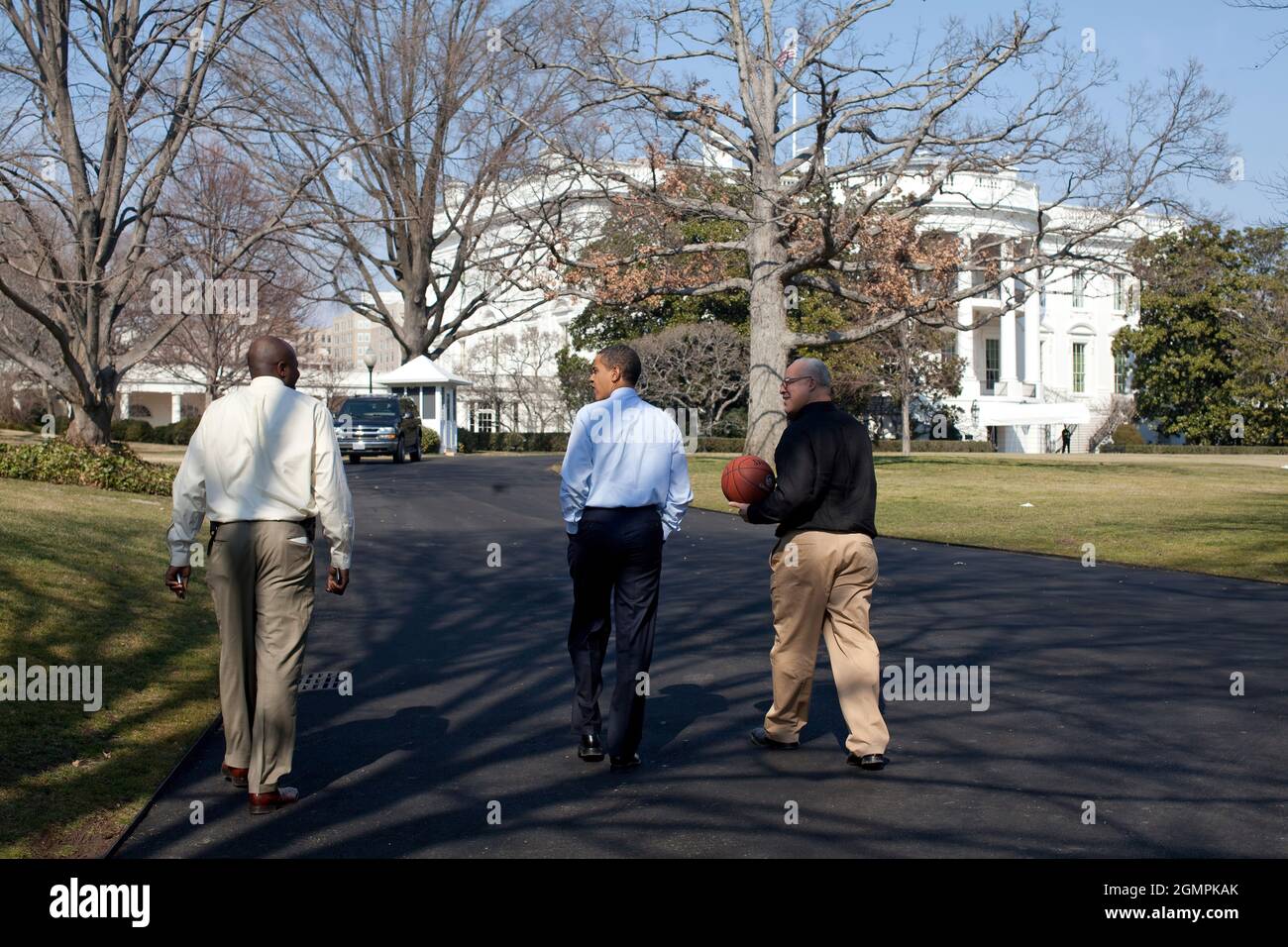 President Barack Obama walks towards the White House with friend Eric ...