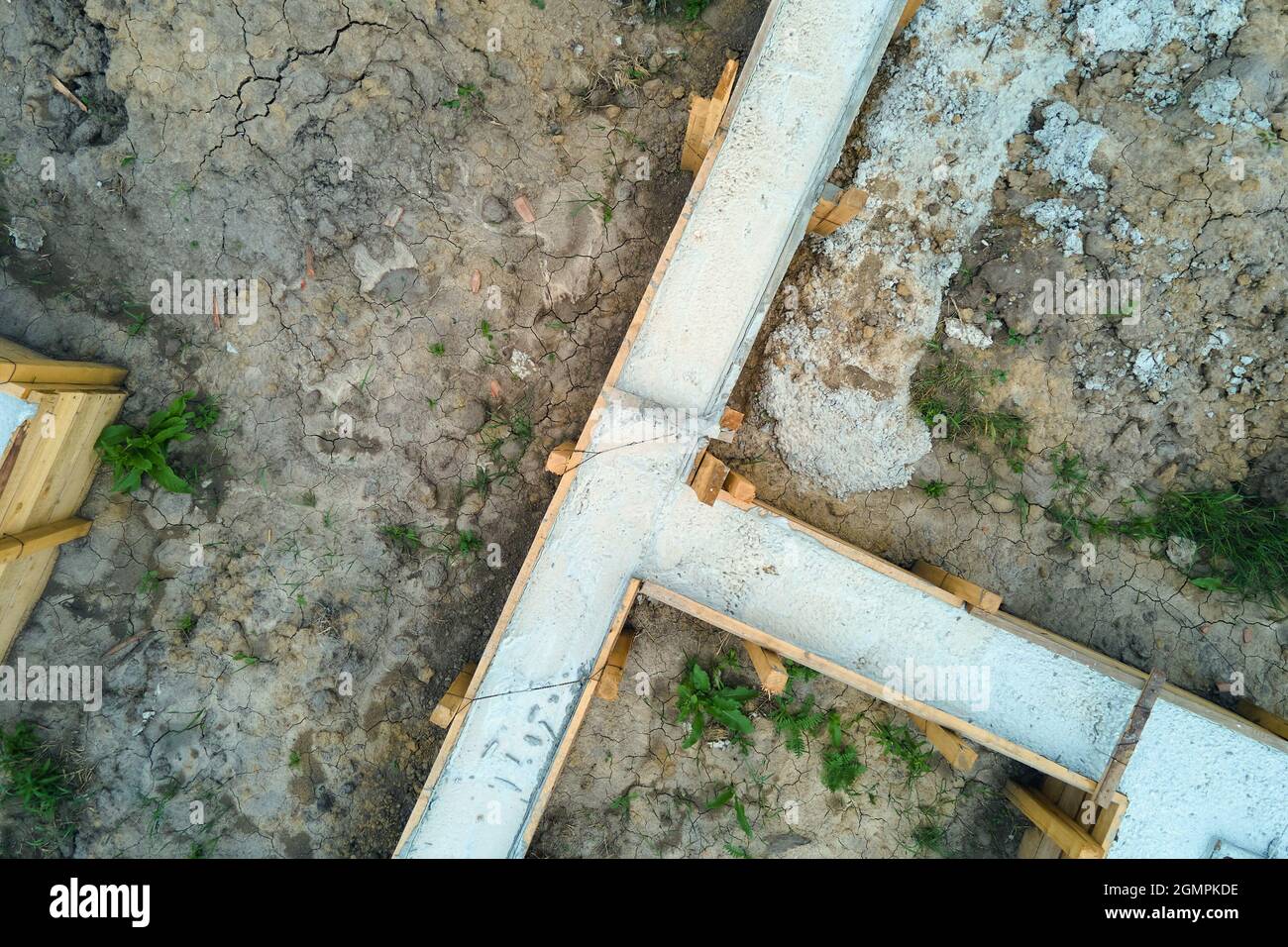 Top down aerial view of building works of new house concrete foundation ...