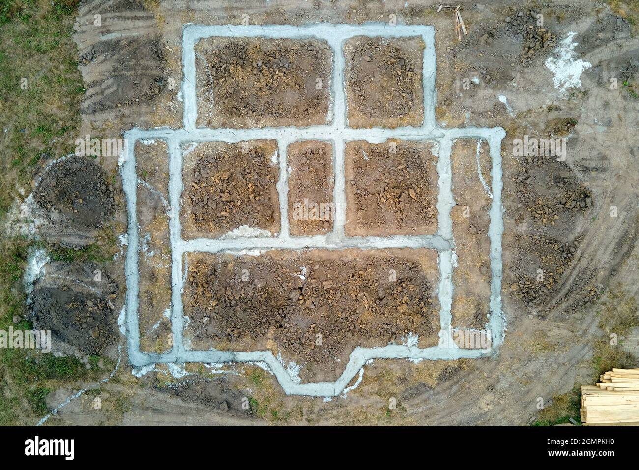 Top down aerial view of building works of new house concrete foundation ...