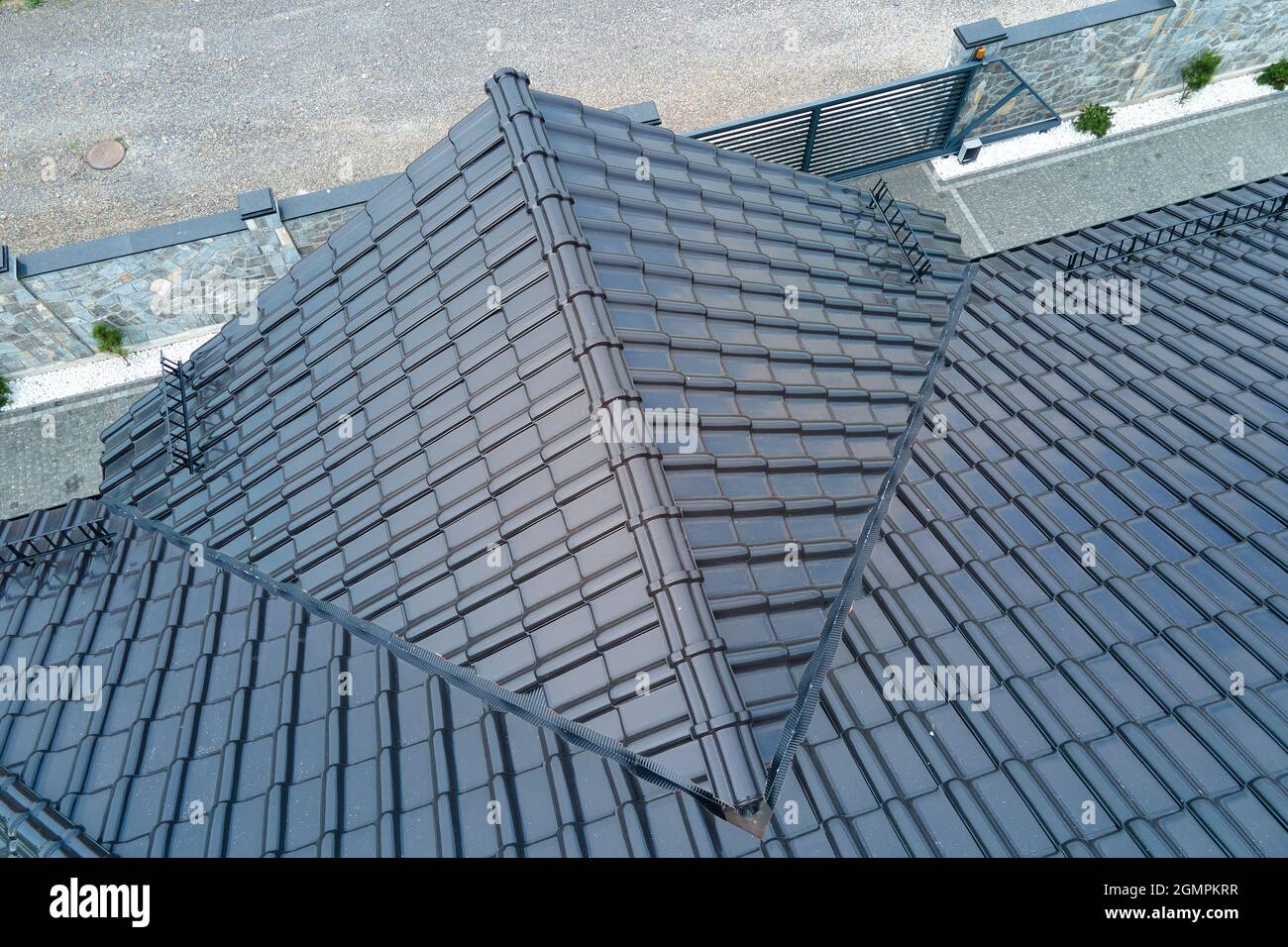 Closeup of house roof top covered with shiny ceramic shingles Stock ...