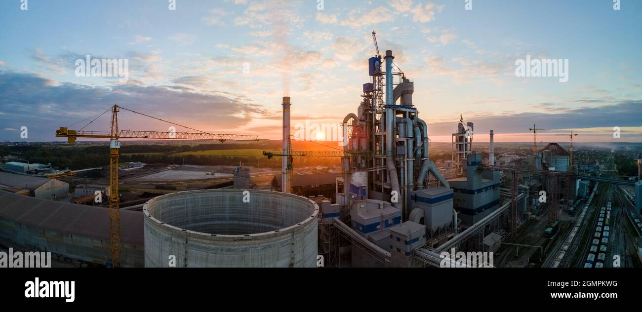 Aerial view of cement factory tower with high concrete plant structure ...