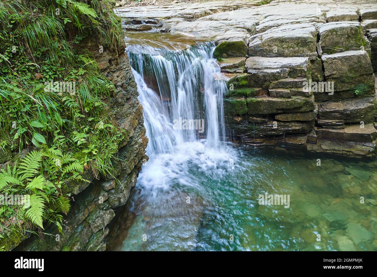 Amazing landscape of beautiful waterfall on mountain river with white ...
