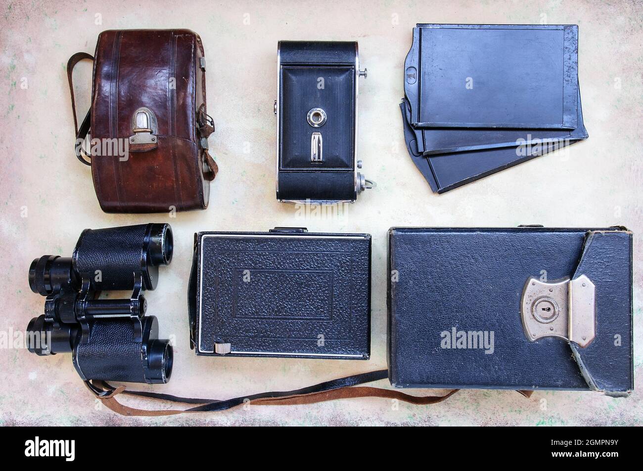 Vintage cameras with cases on a light background. Top view Stock Photo ...