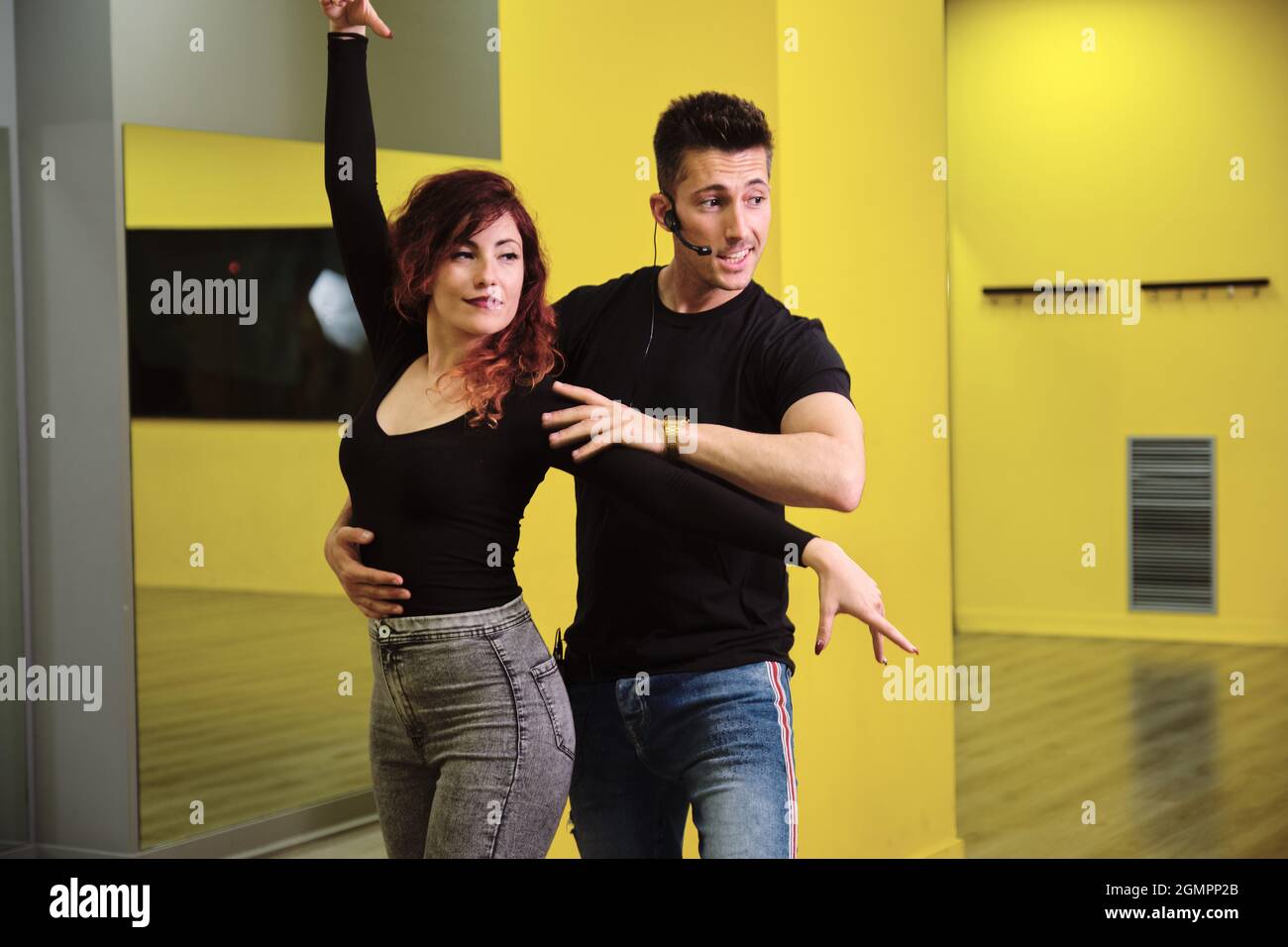 Salsa and bachata teachers in a class Stock Photo - Alamy