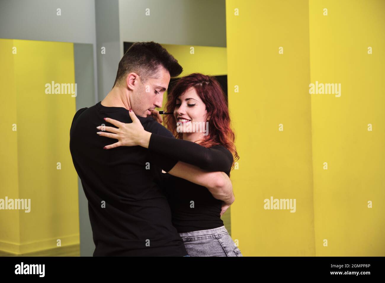Salsa and bachata teachers in a class Stock Photo - Alamy