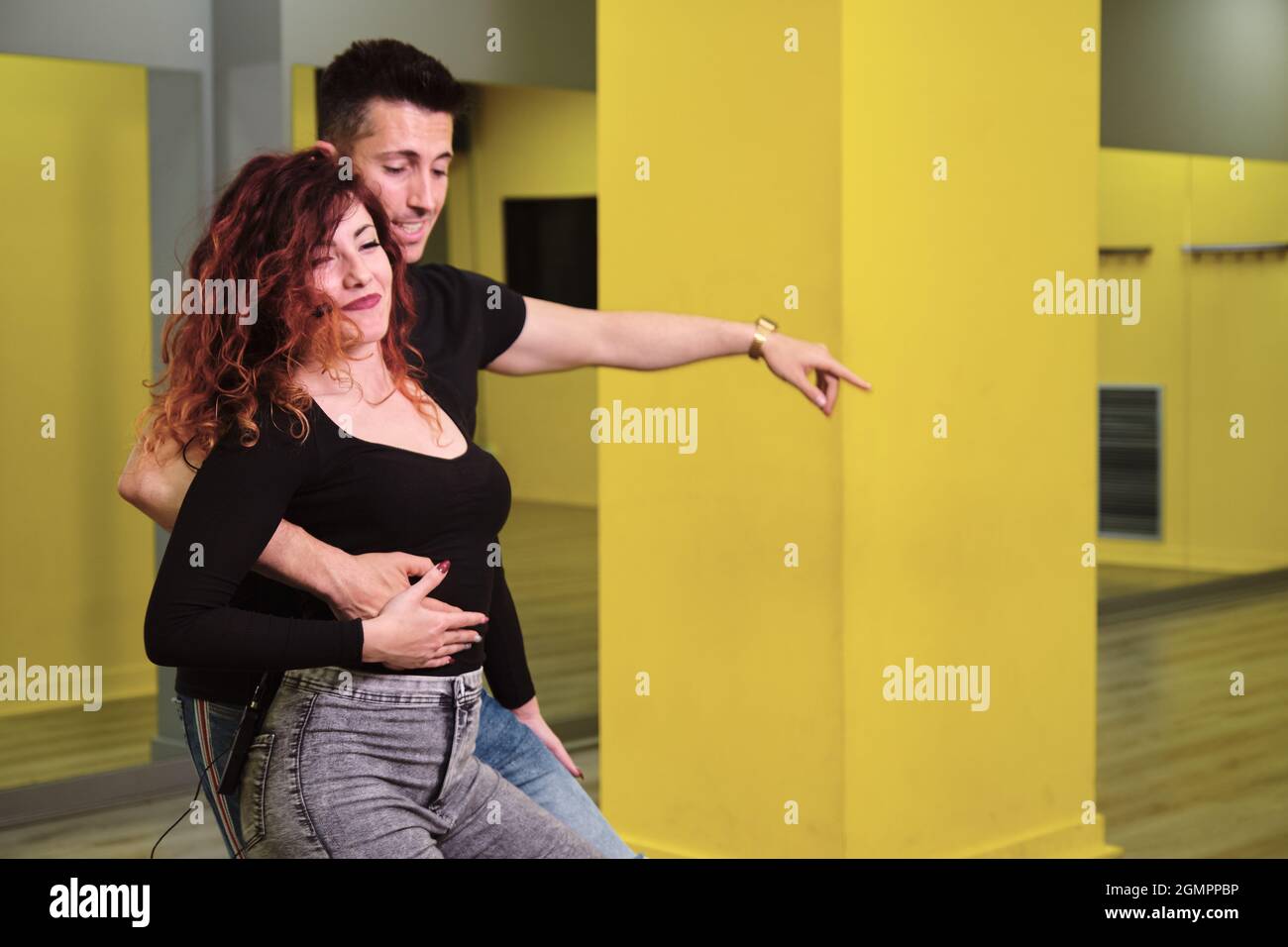 Salsa and bachata teachers in a class Stock Photo - Alamy