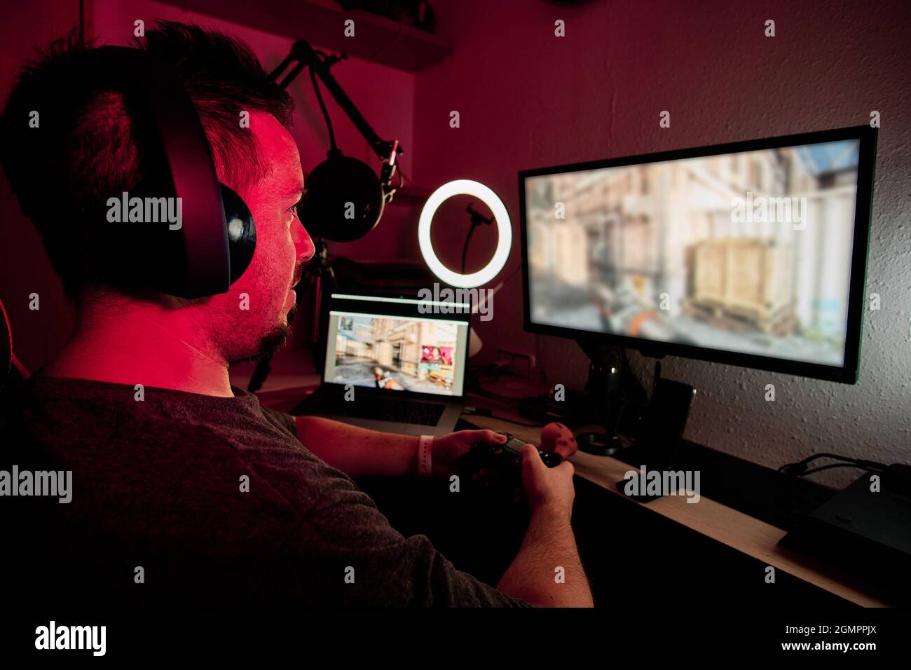 a gamer playing and streaming live with microphones and cameras Stock ...